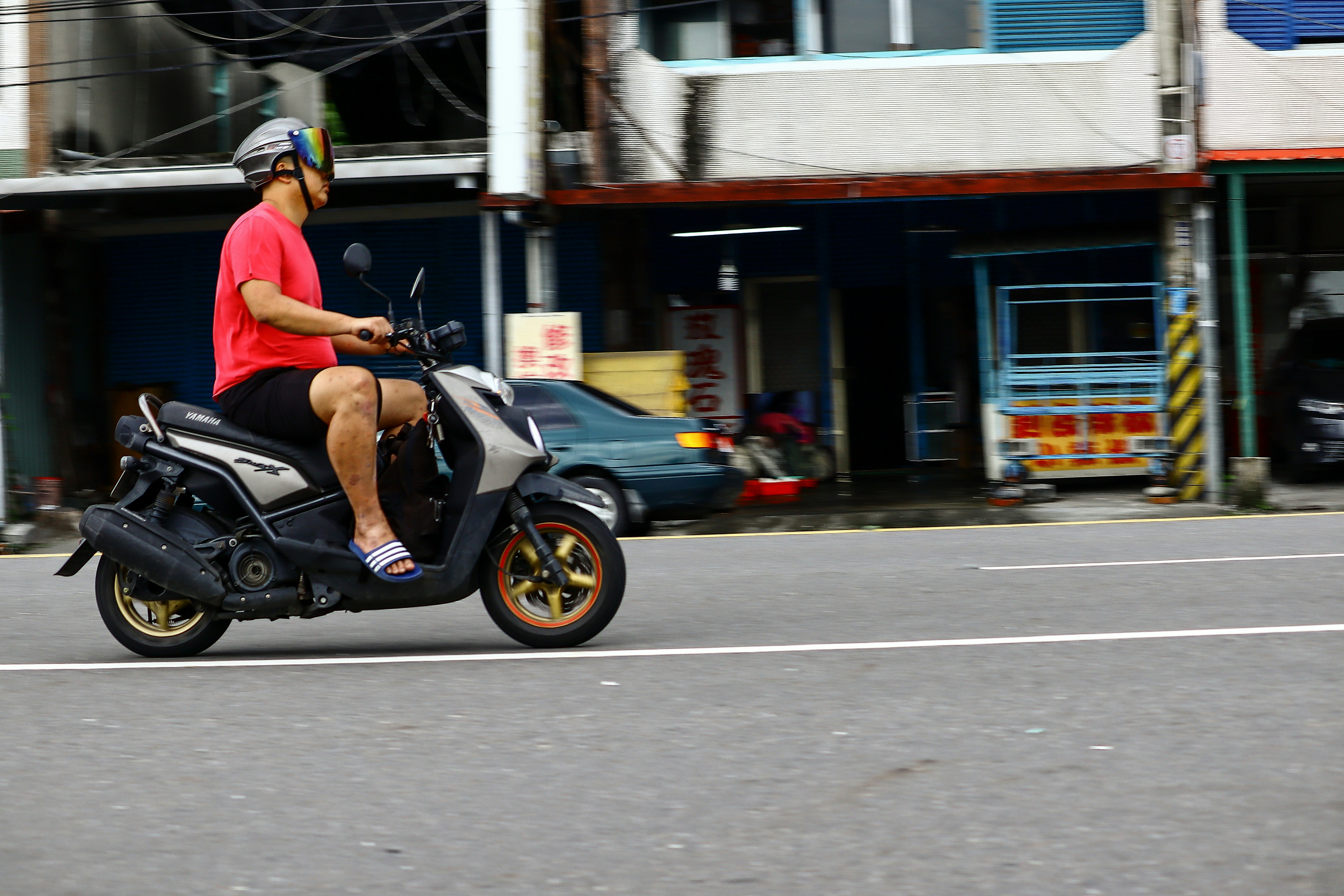 Man wearing red shirt riding on motor scooter photo – Free Person Image ...