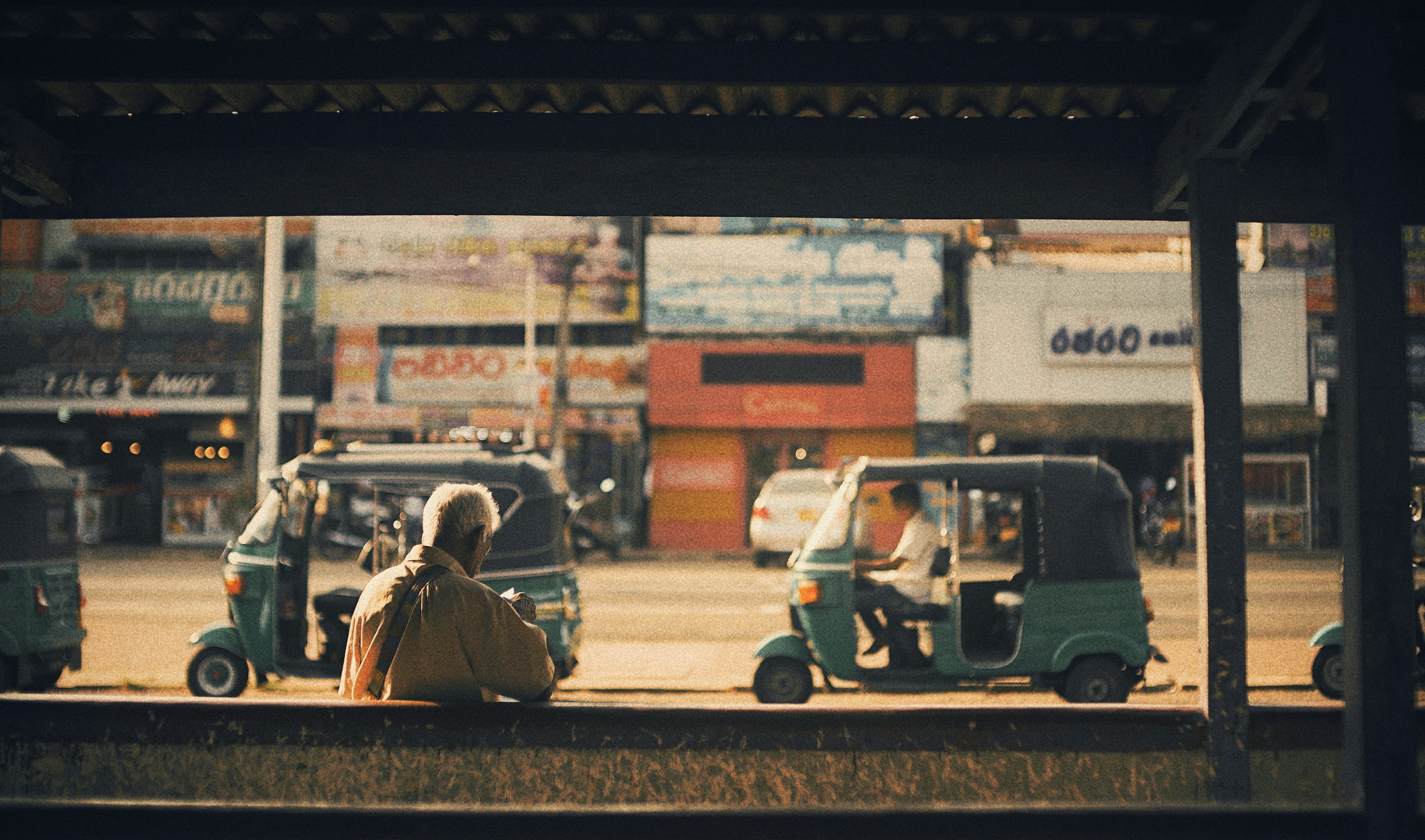 Person sitting in a bench near cars during daytime photo – Free Car ...