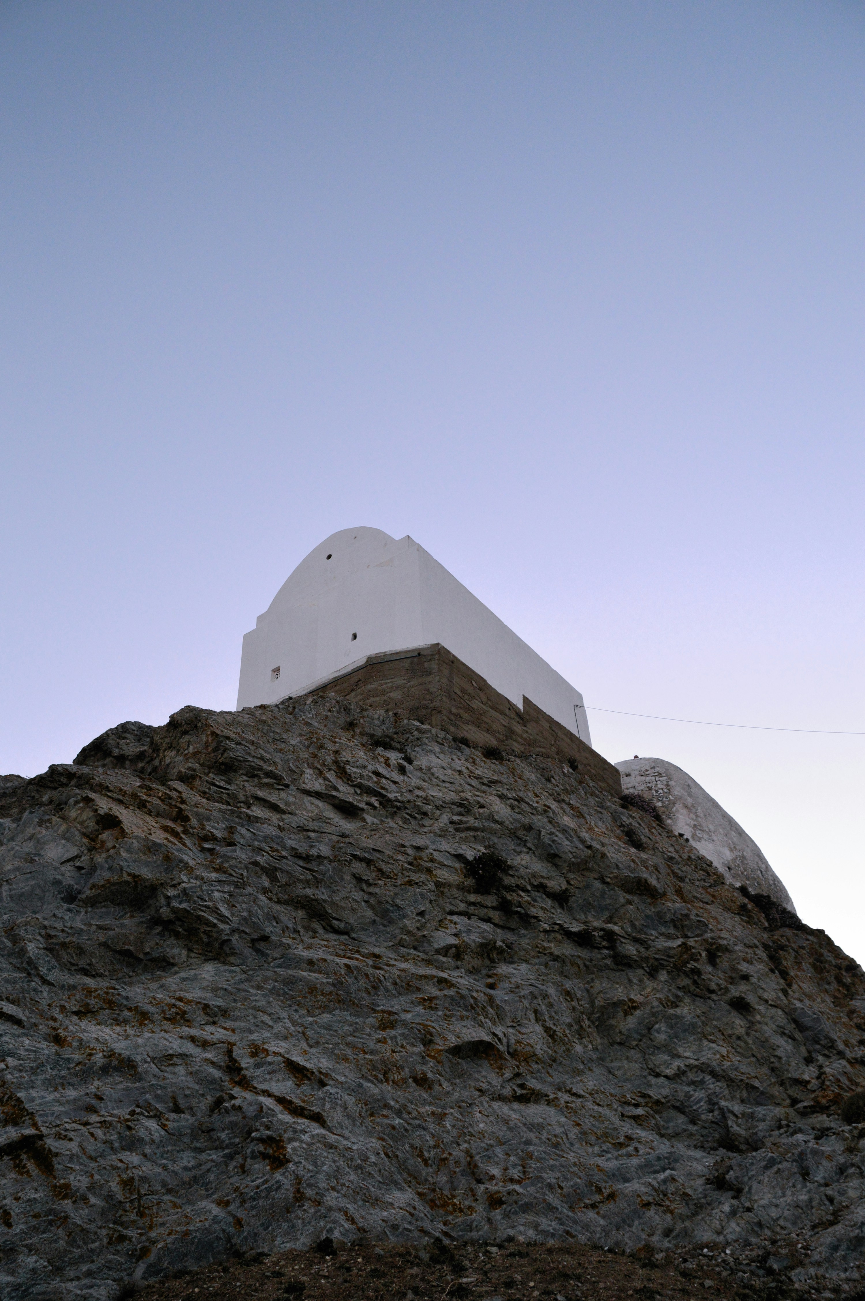 Clifftop White Bastion under a Quiet Gradient Sky