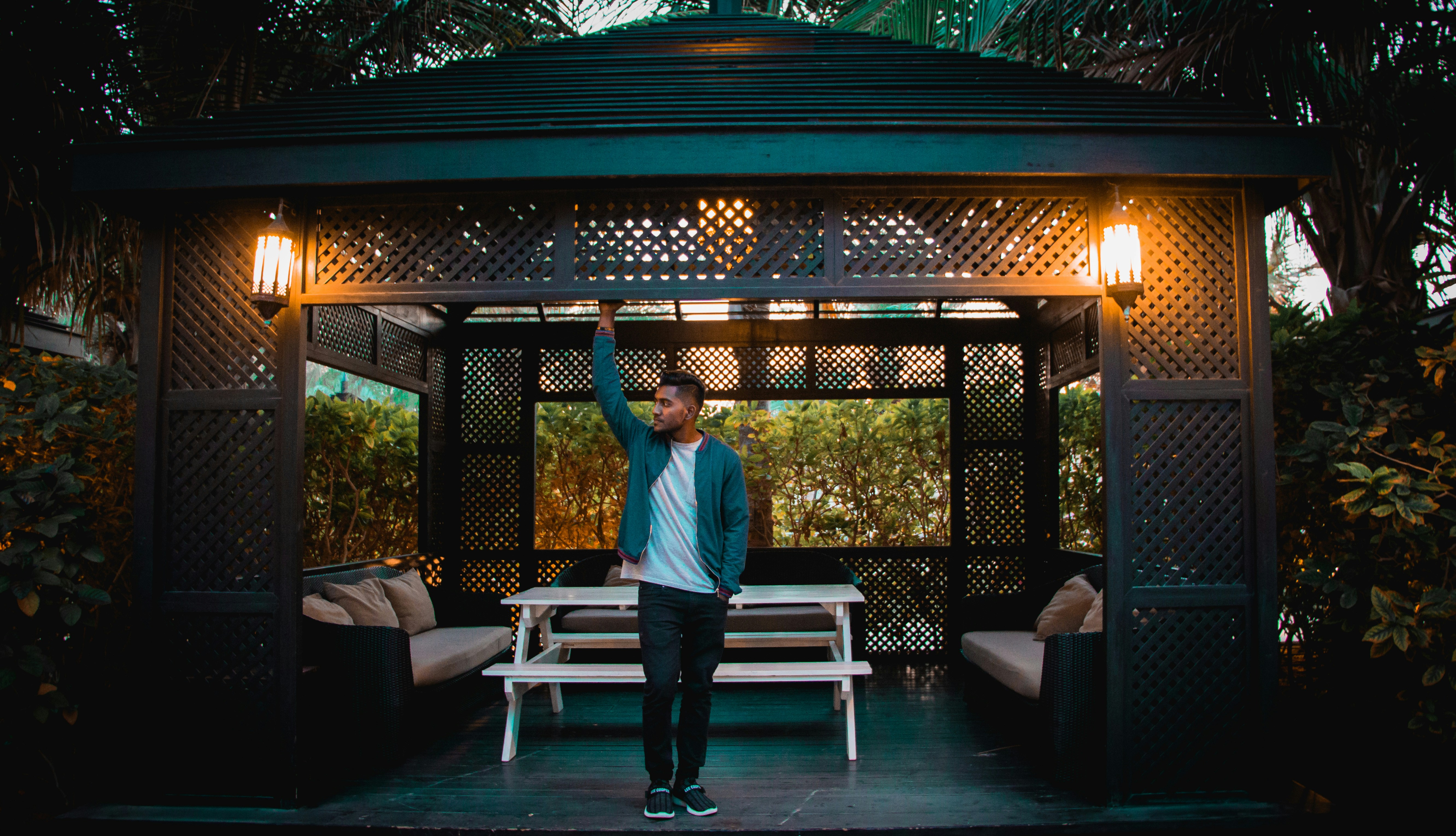 Central Figure Under Lanterns in a Cozy Outdoor Pavilion