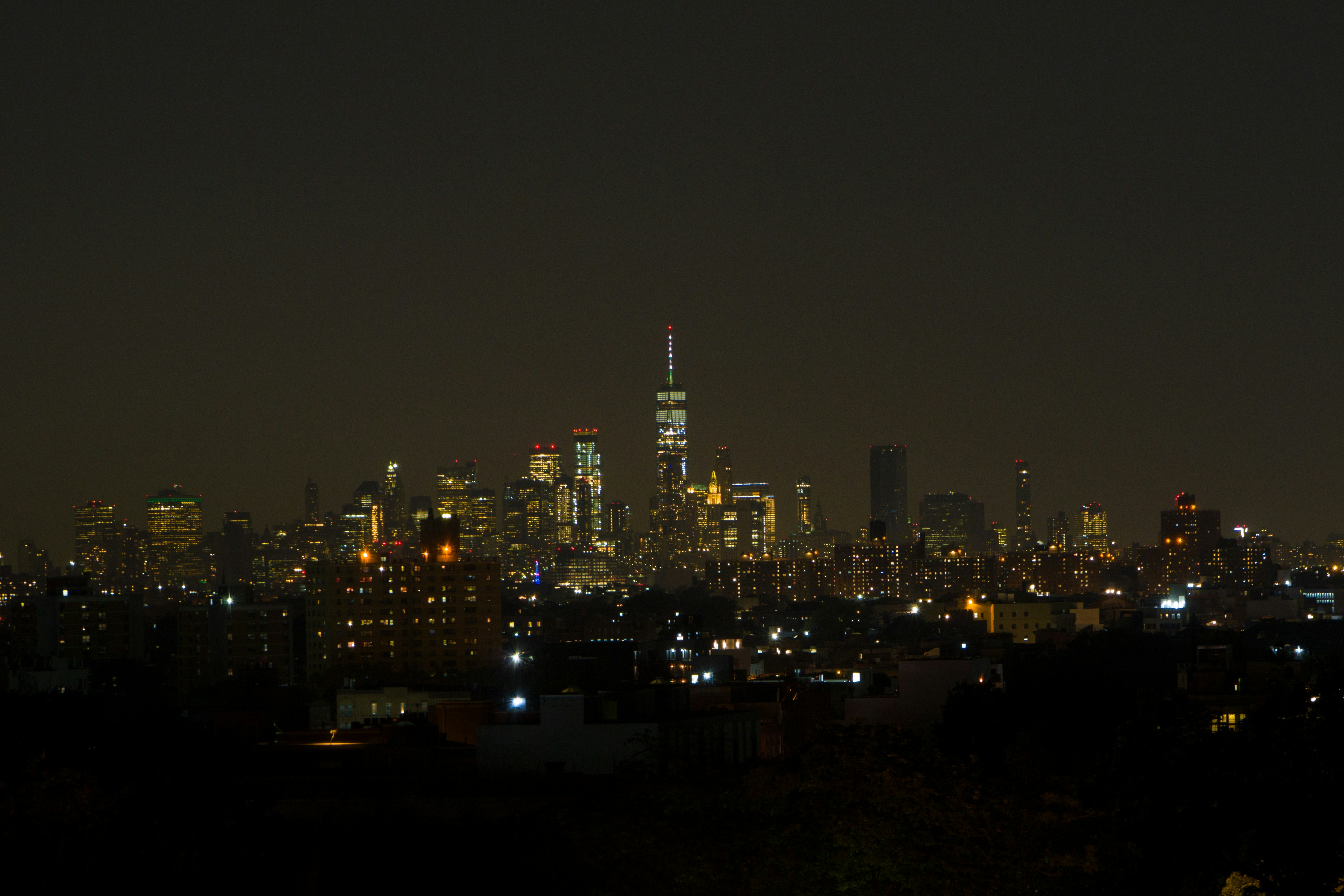 City skyline illuminated against a dark night sky.