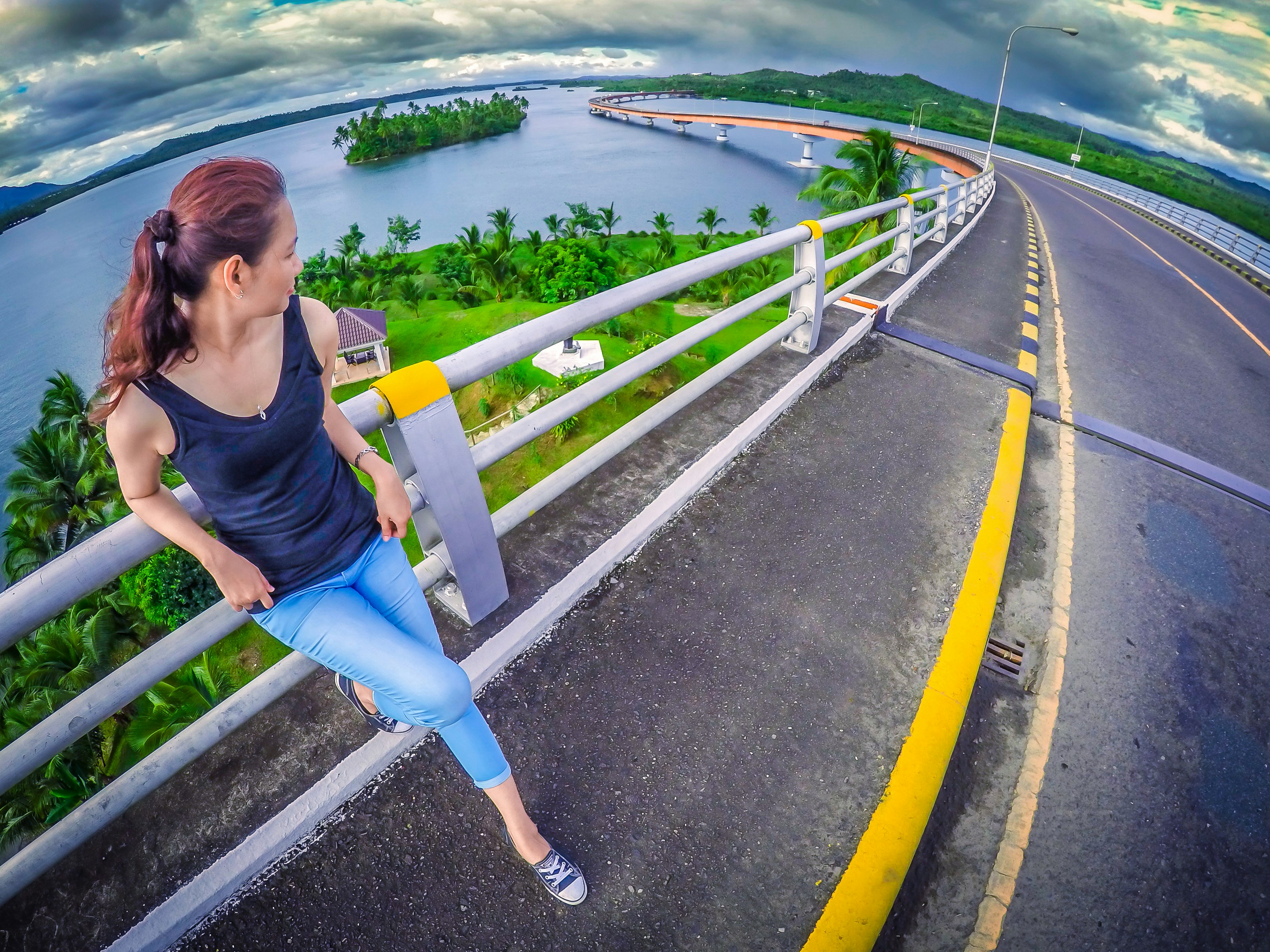Woman wearing black camisole leaning on grey railings photo – Free ...