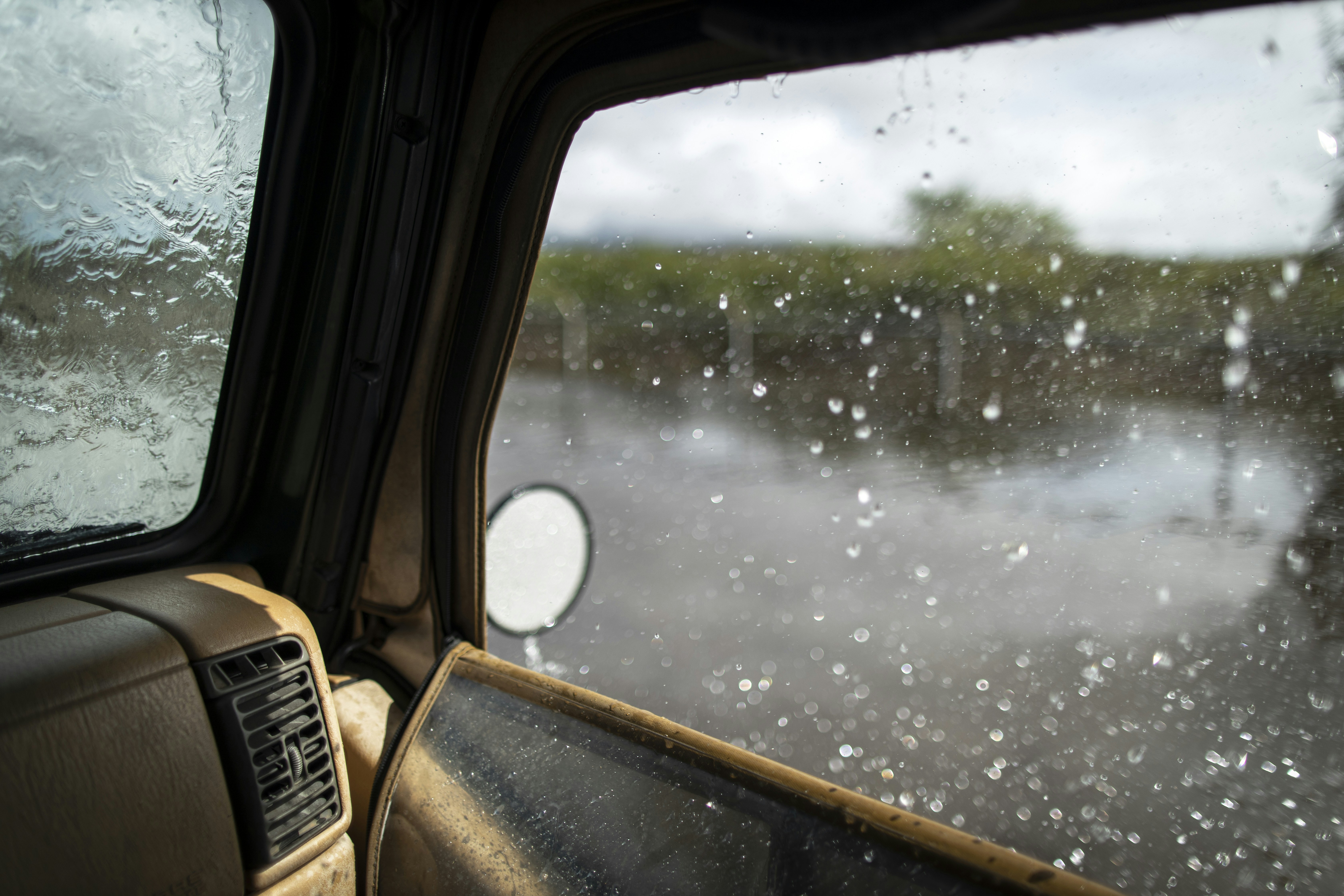 Rain-Streaked Cab Window: A Quiet Moment Between Motion and Stillness