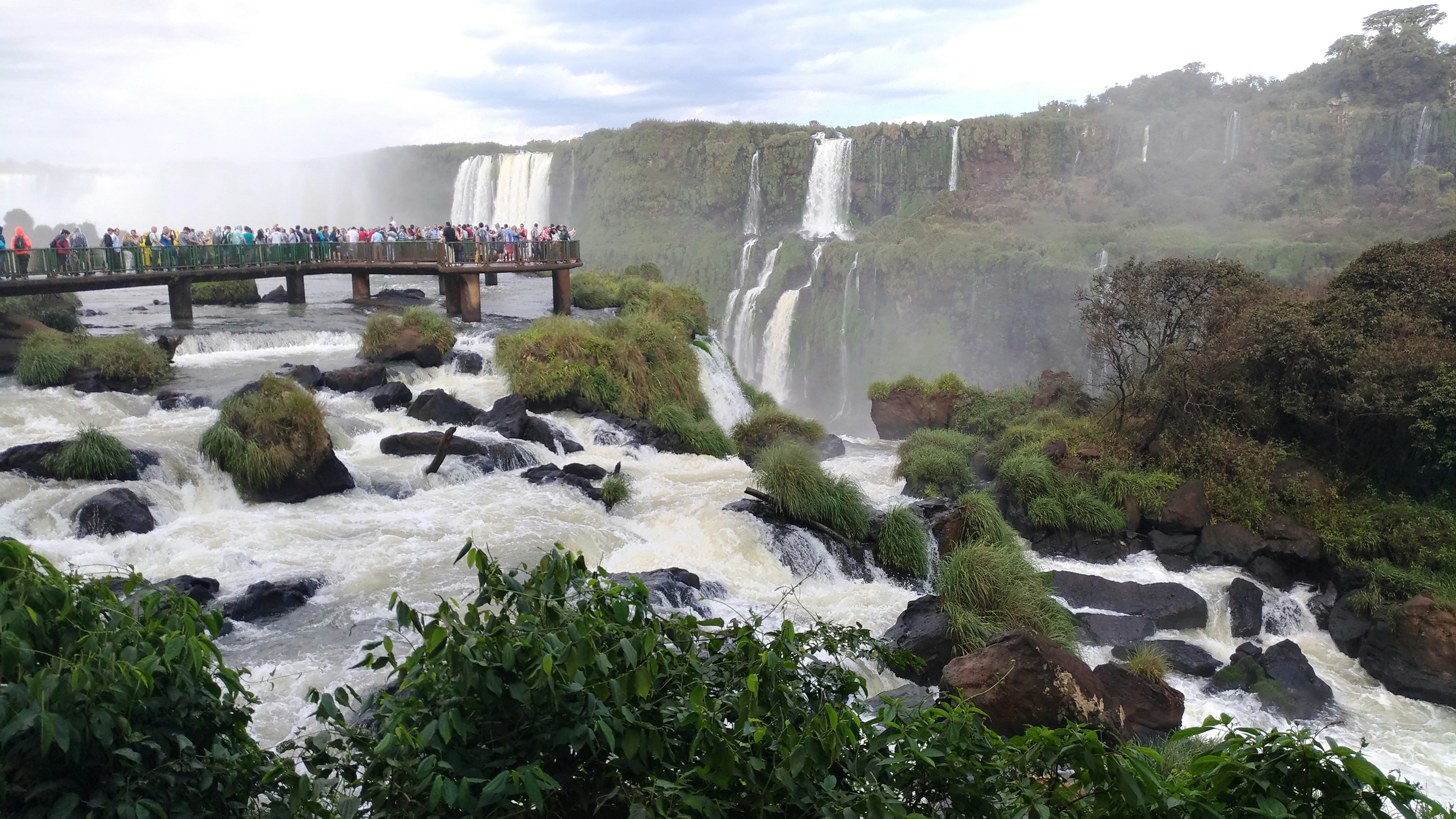 waterfalls and people on concrete dock