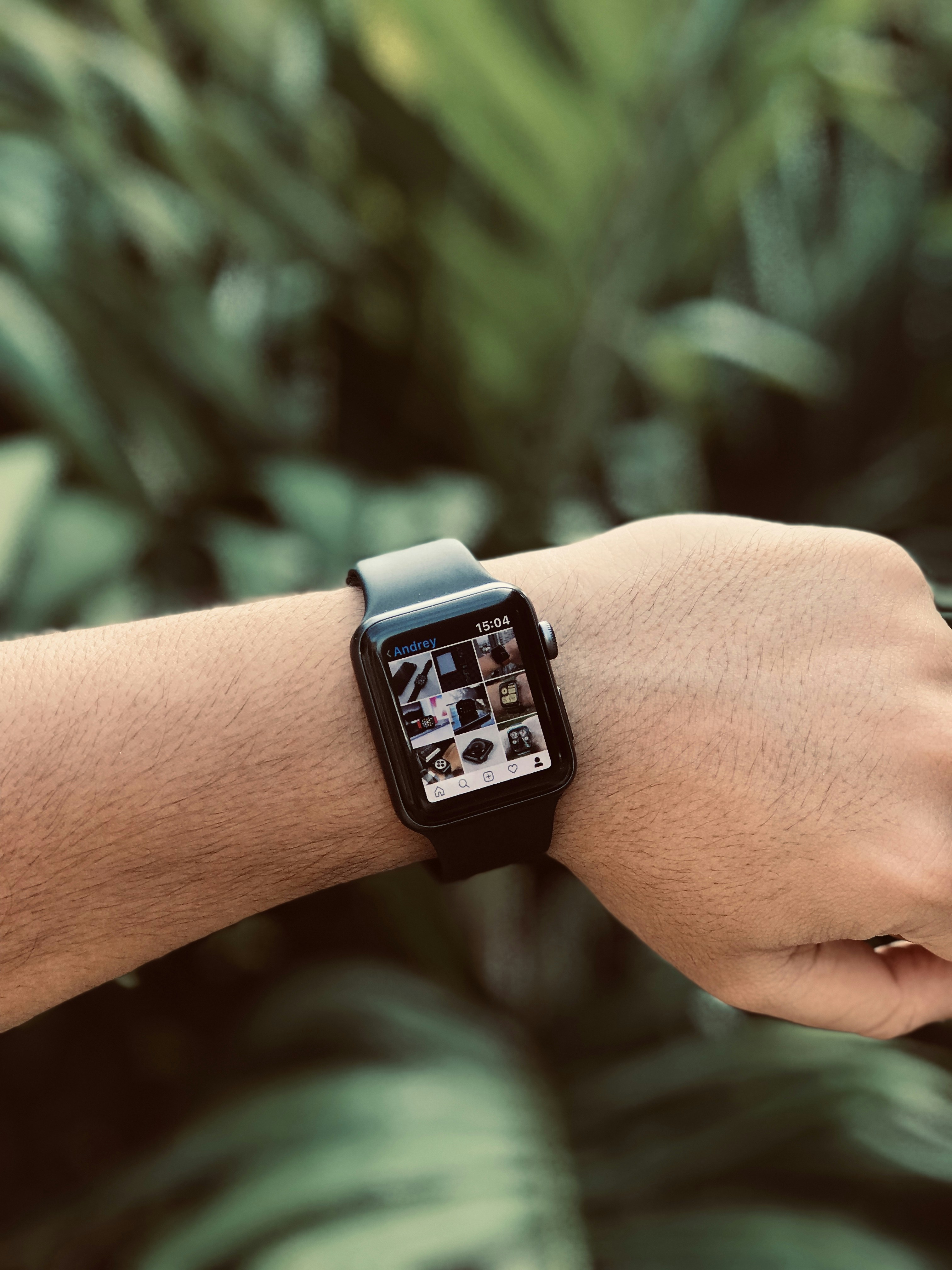 Soft Focus Timepiece: Apple Watch on a Green Blur
