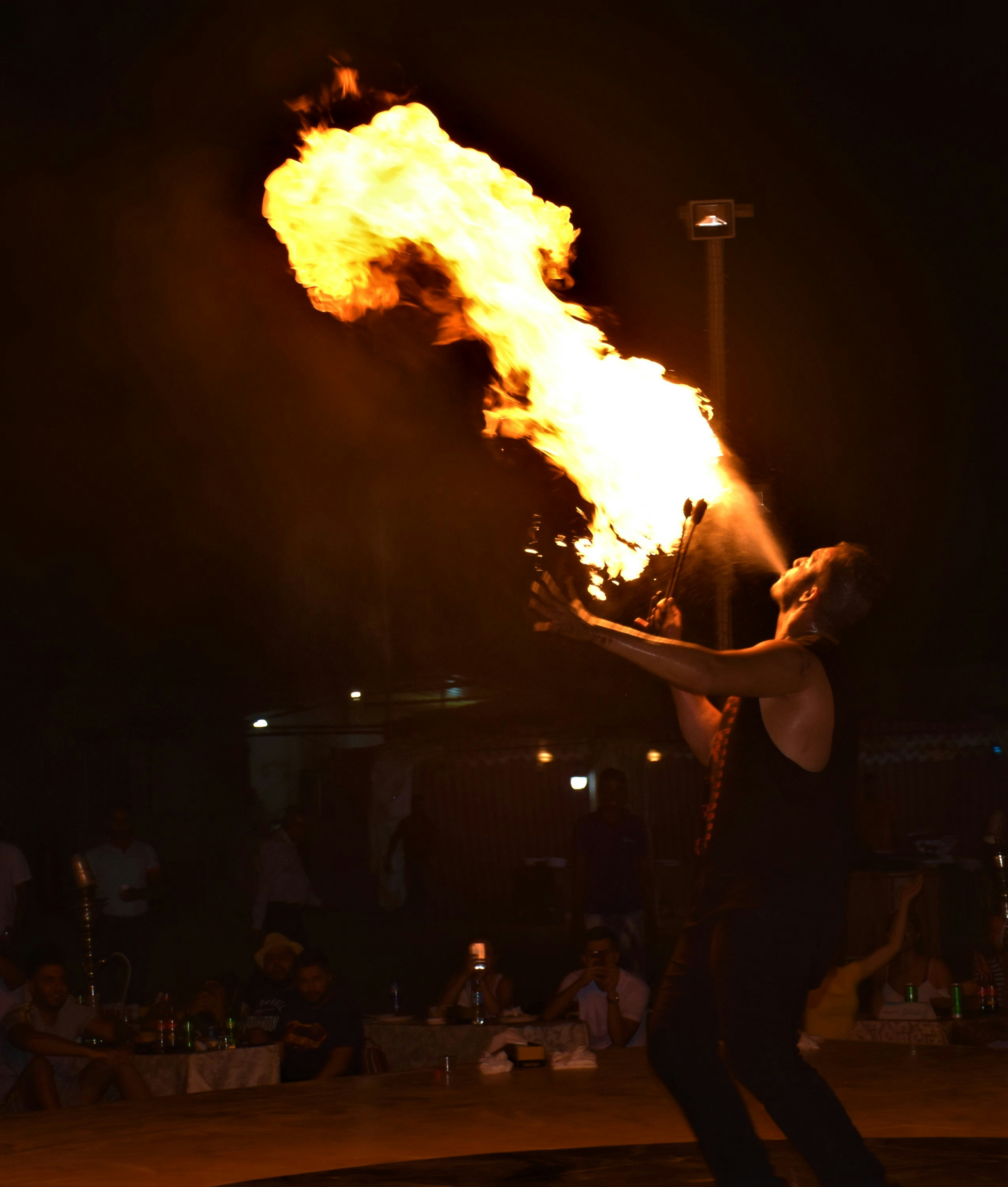 Man performing on stage with fire breath photo – Free Human Image on ...