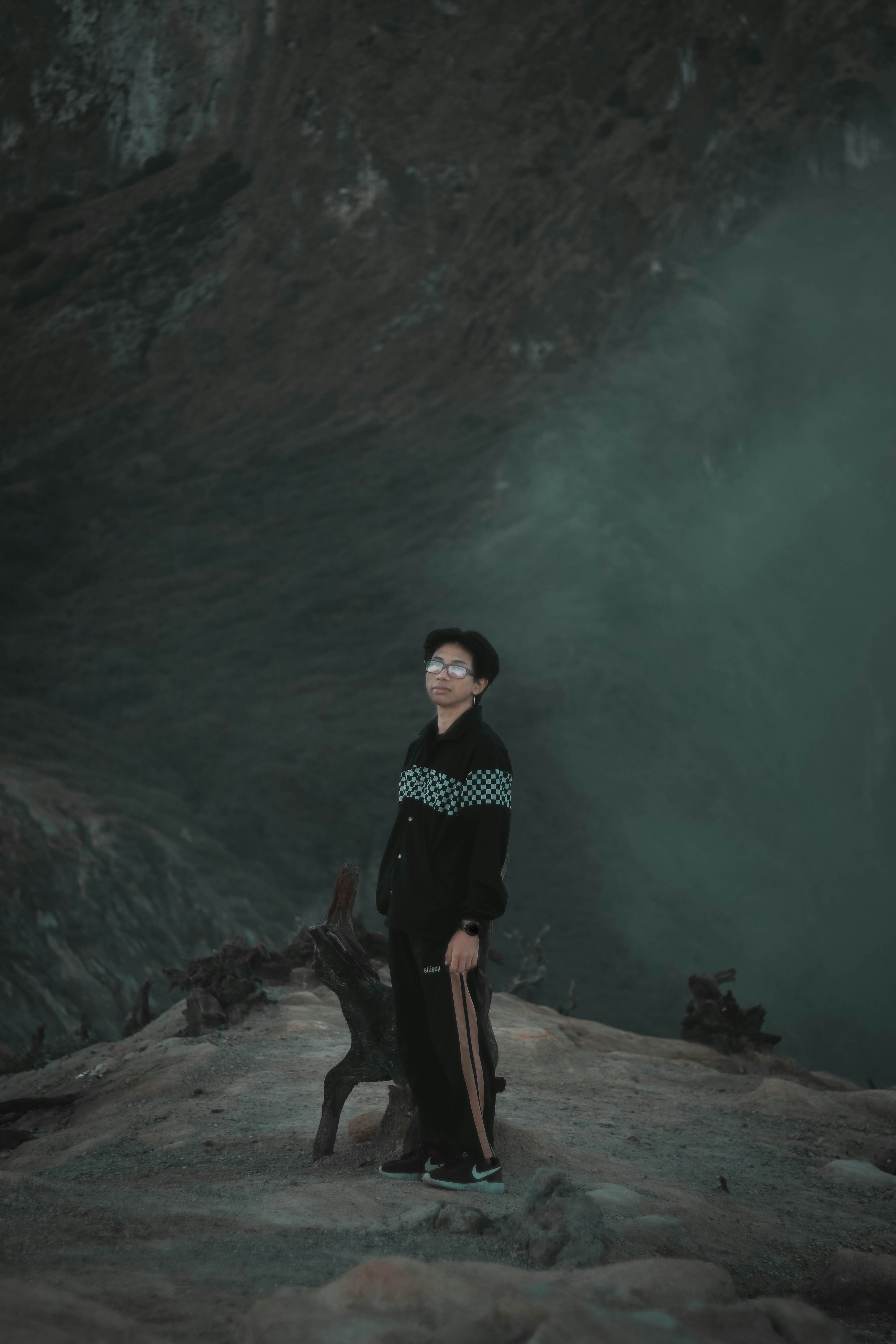 Curious Explorer at the Mouth of a Misty Crater