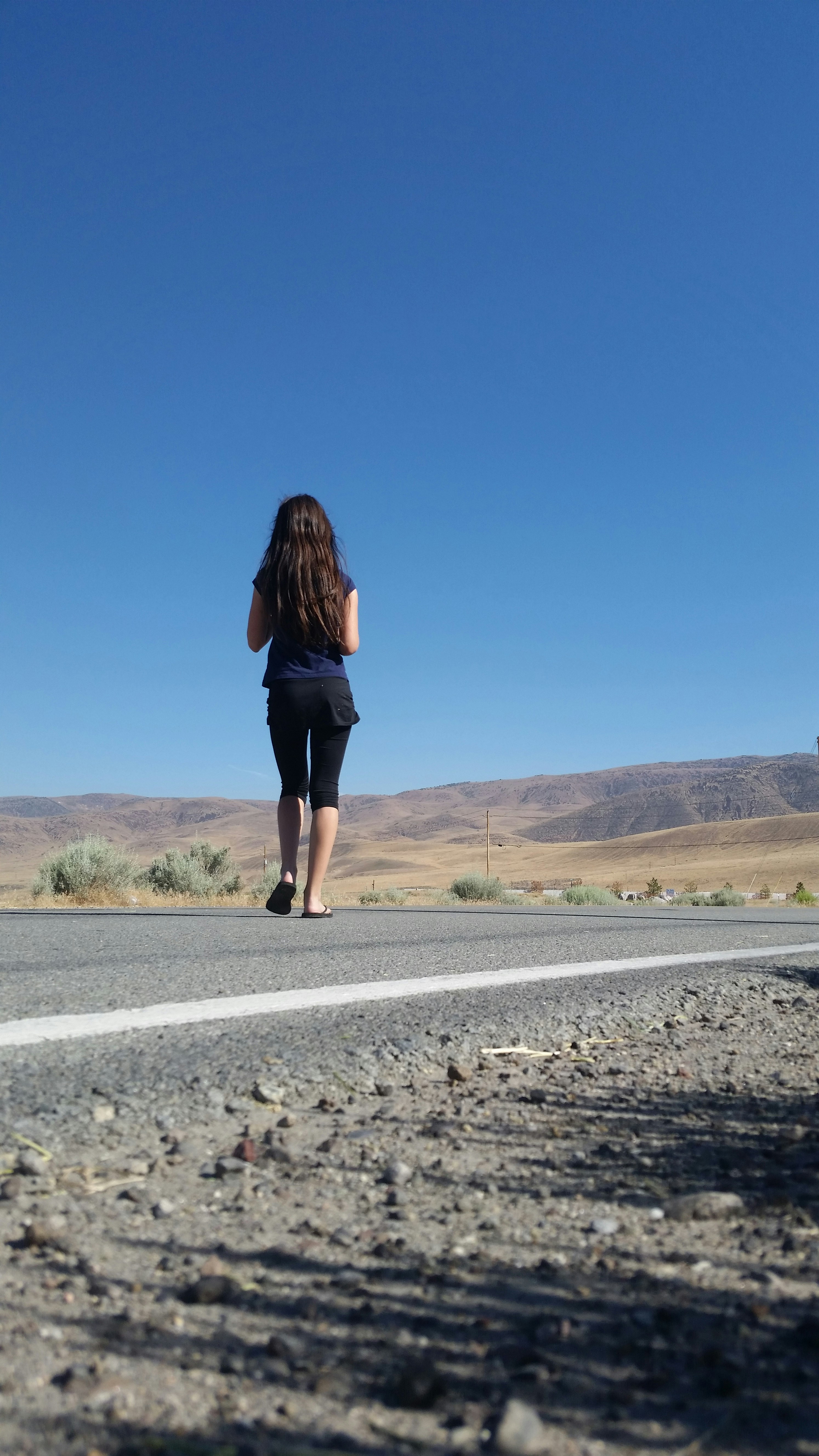 Girl standing in road during daytime photo – Free Human Image on Unsplash
