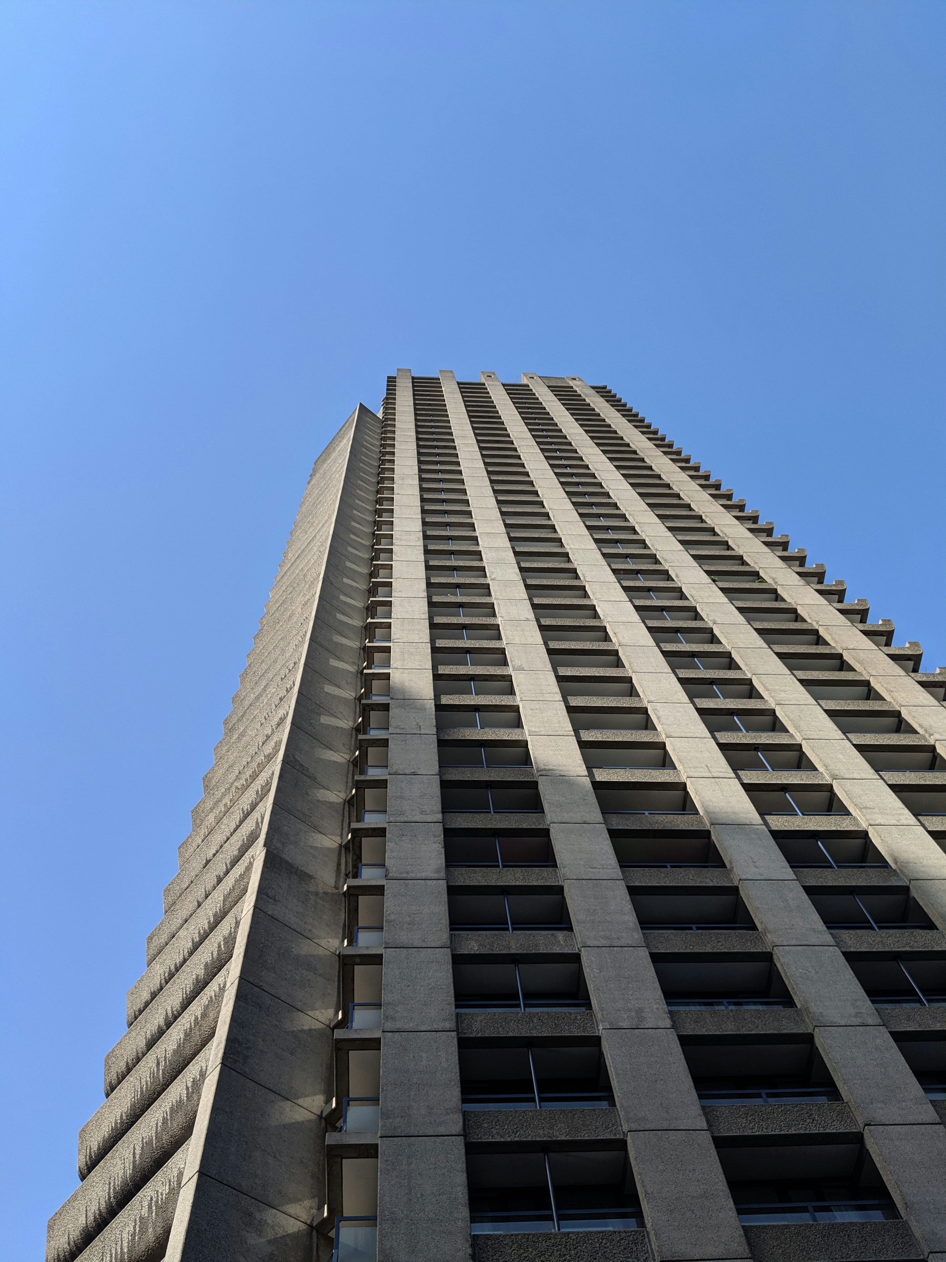 Worm view photo of gray concrete building photo – Free Urban Image on ...