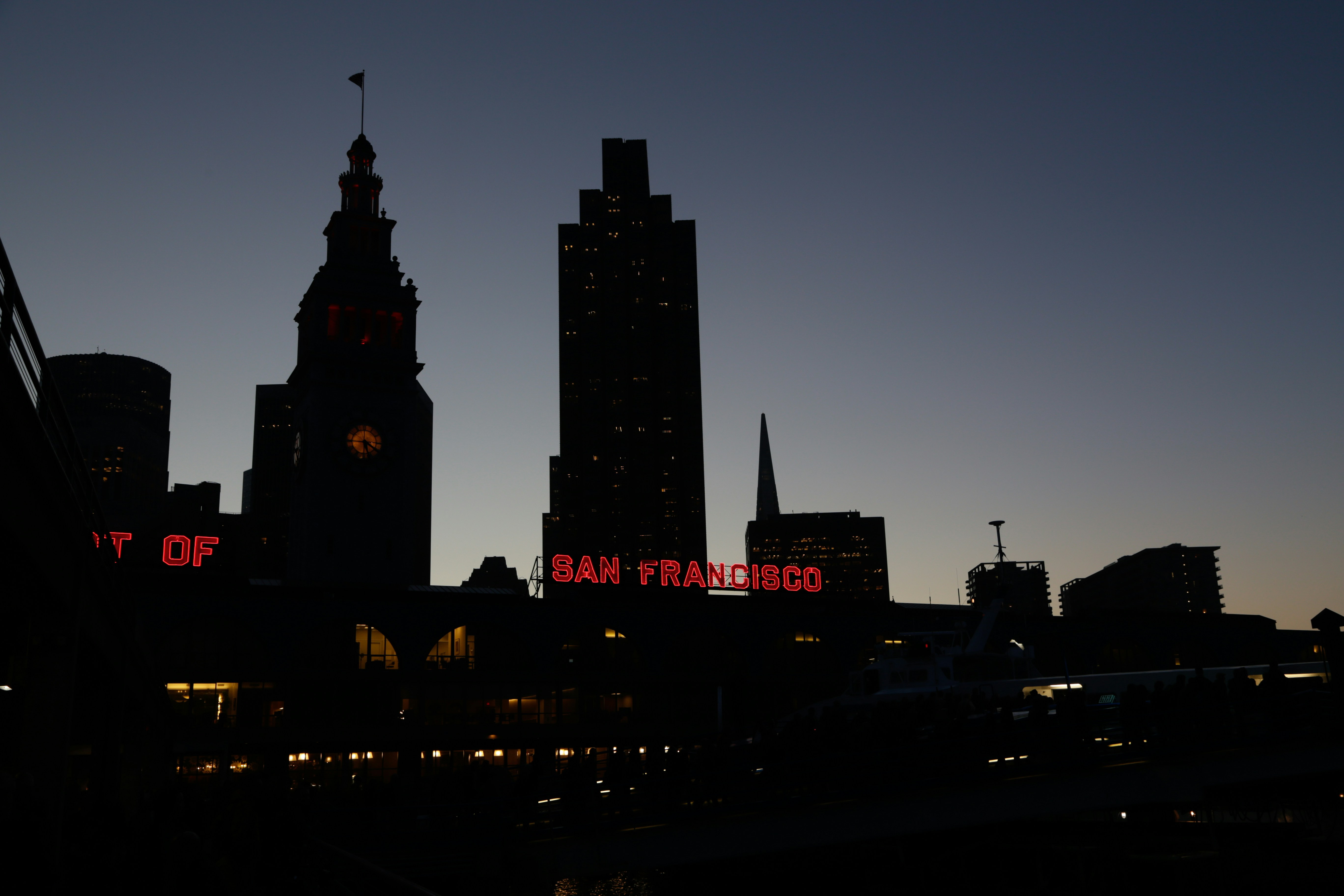 Neon Skyline at Dusk: San Francisco Wharf in Silhouette