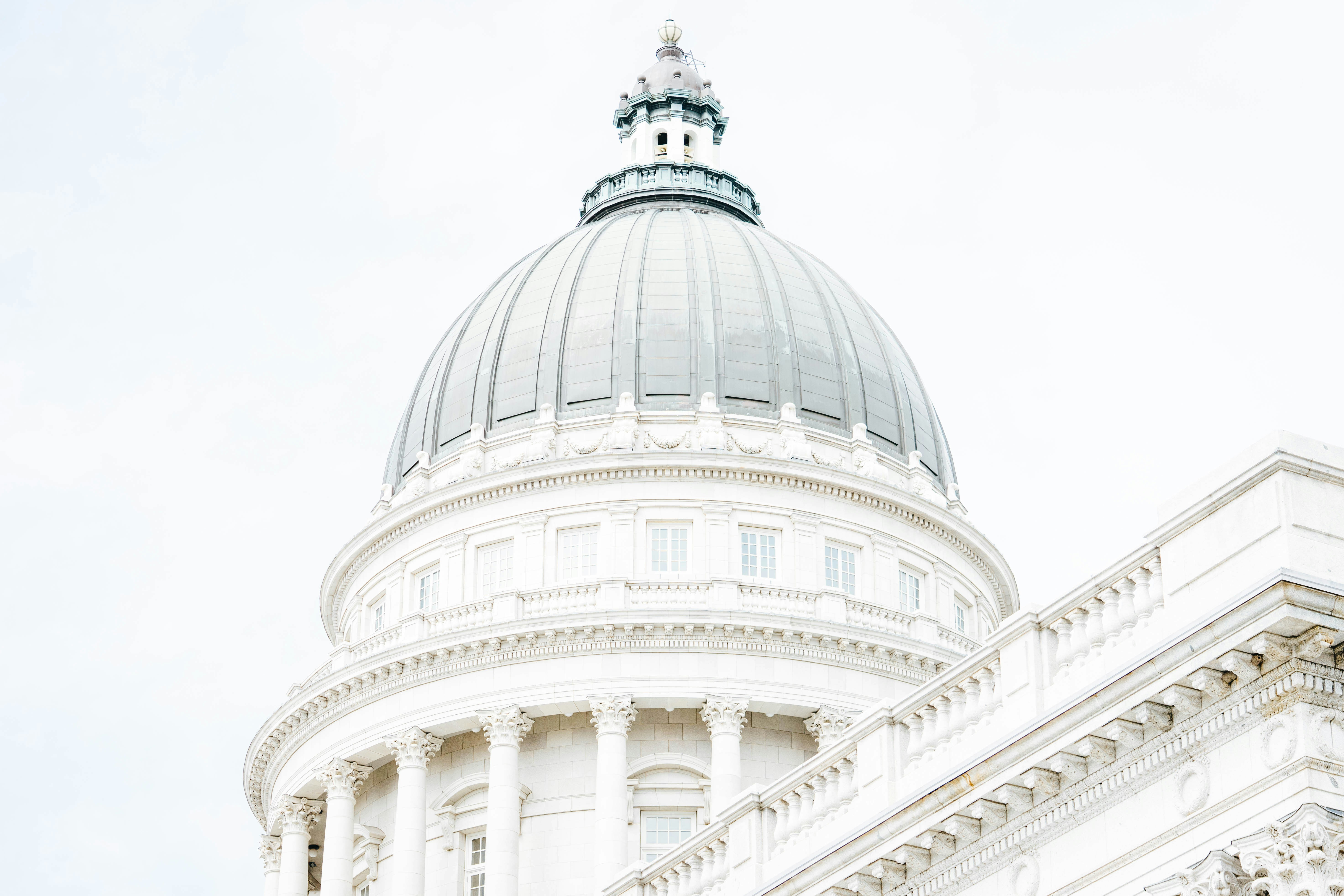 Grey and white domed building with intricate classical details.