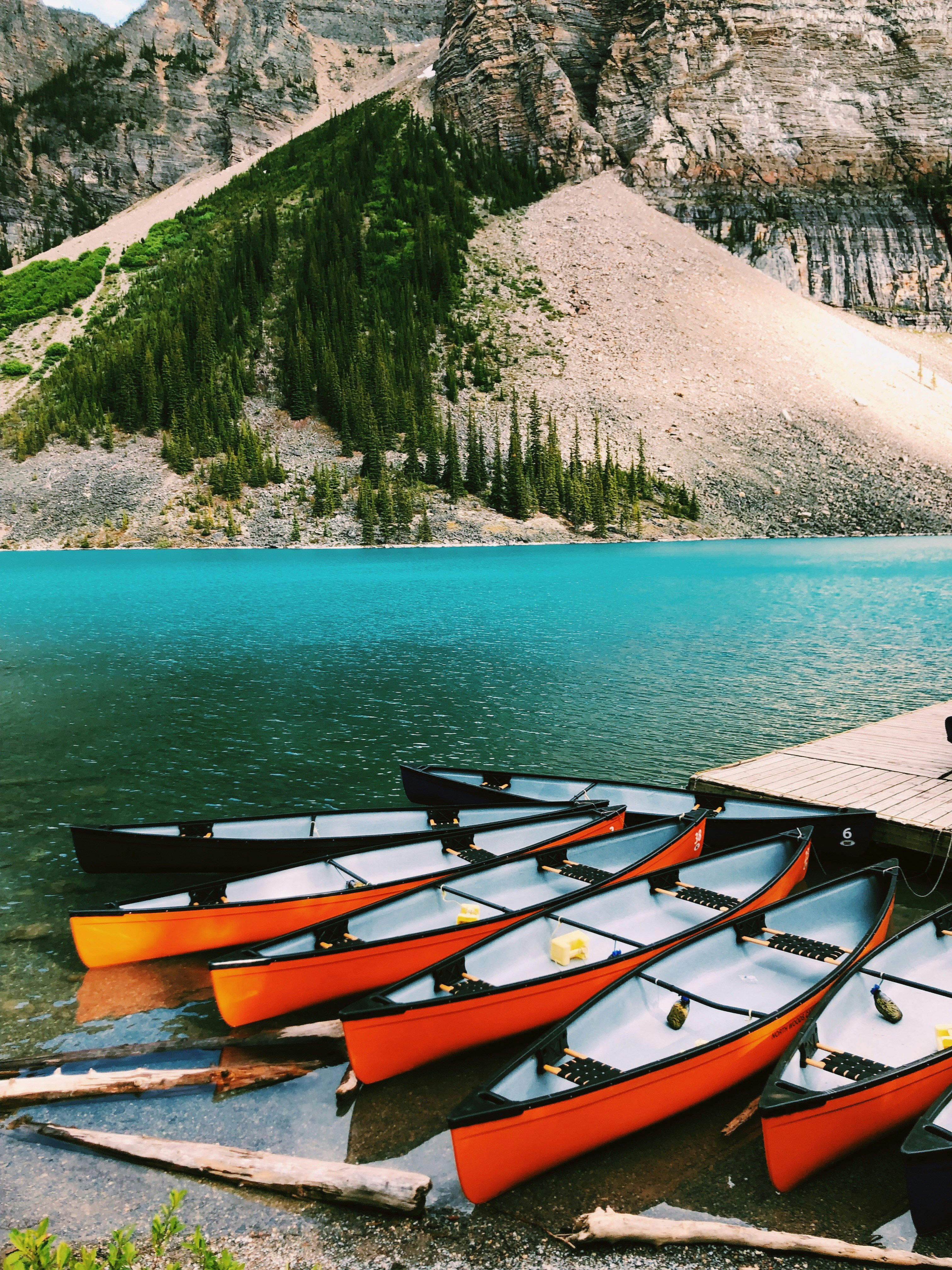 Orange canoe photo – Free Blue Image on Unsplash
