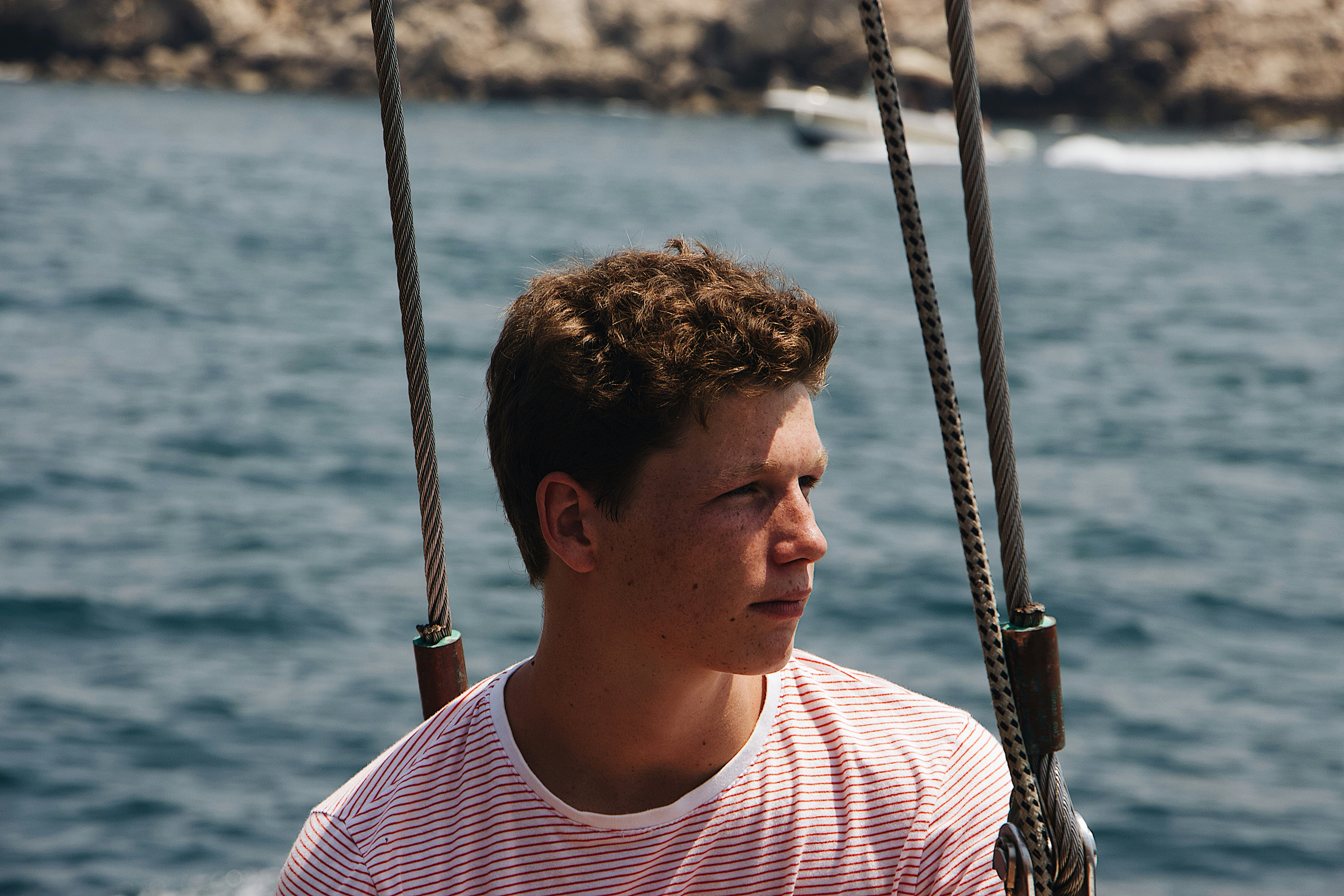 Profile at Sea: Quiet Sailor Between Ropes