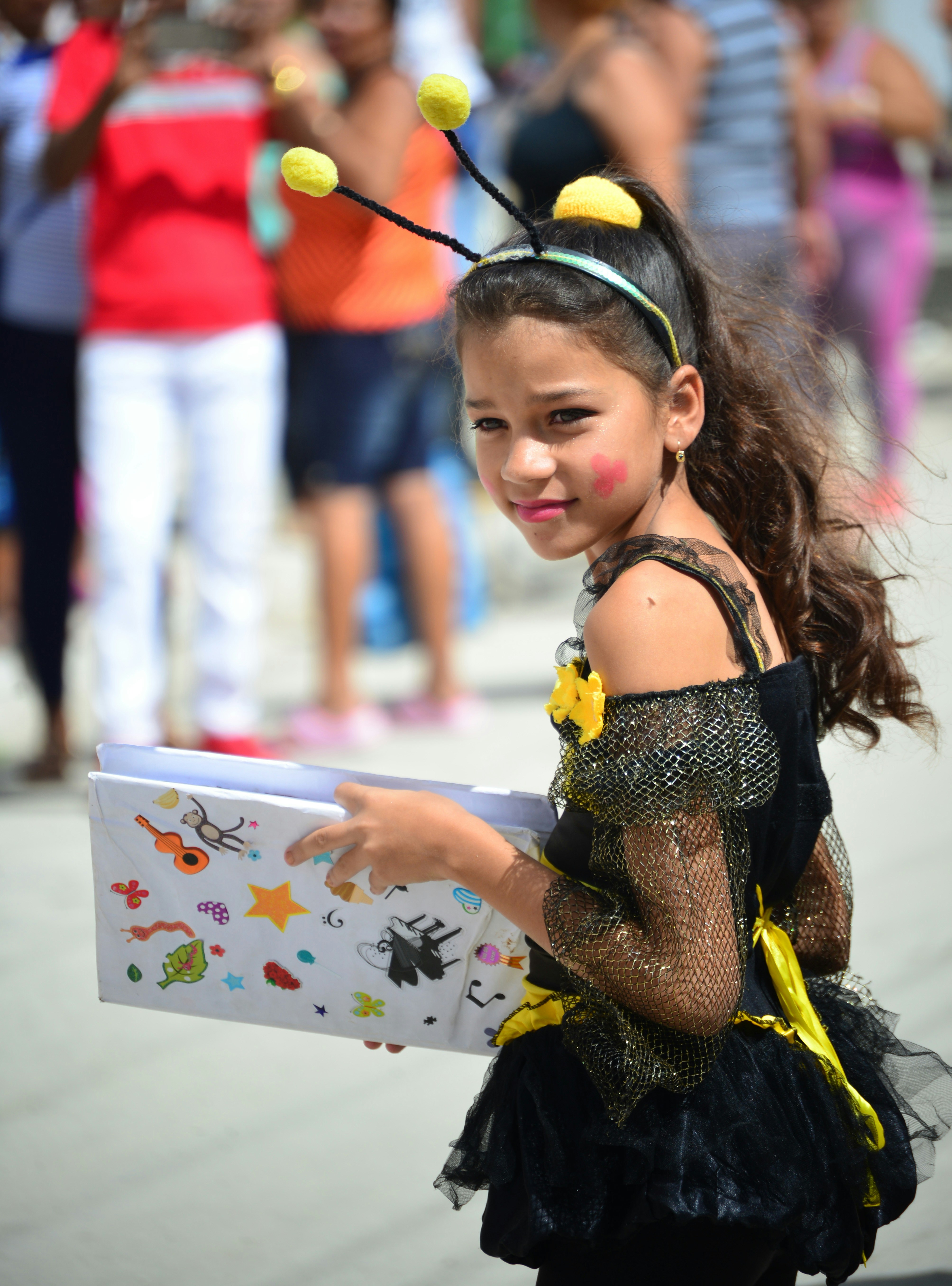 Carnival Cheer: A Little Mascot Surprises the Crowd