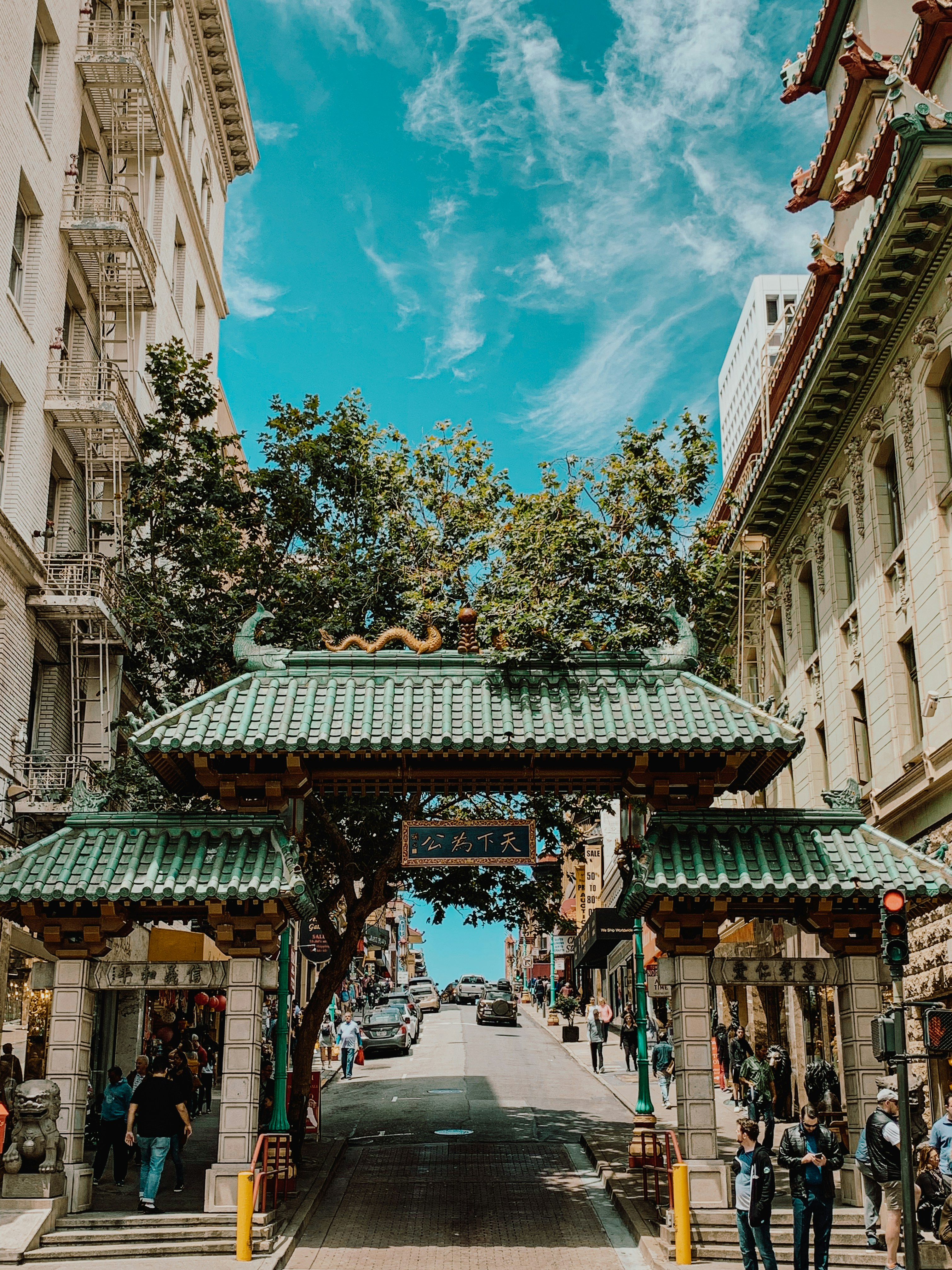 Green-Tiled Paifang Framing a Sunlit Chinatown Street