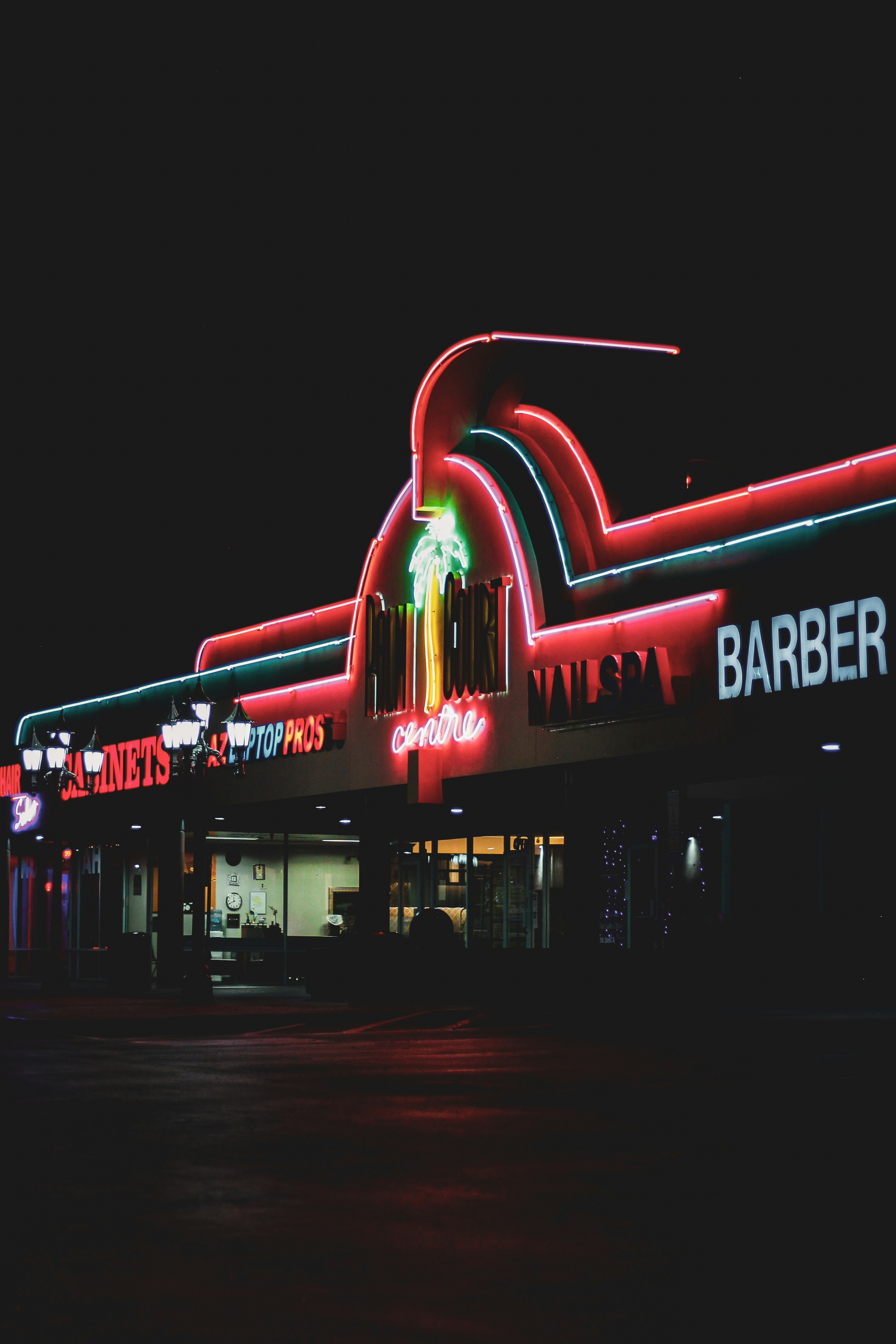 Neon Nostalgia: Nightlife Signage Through a Distant Glare