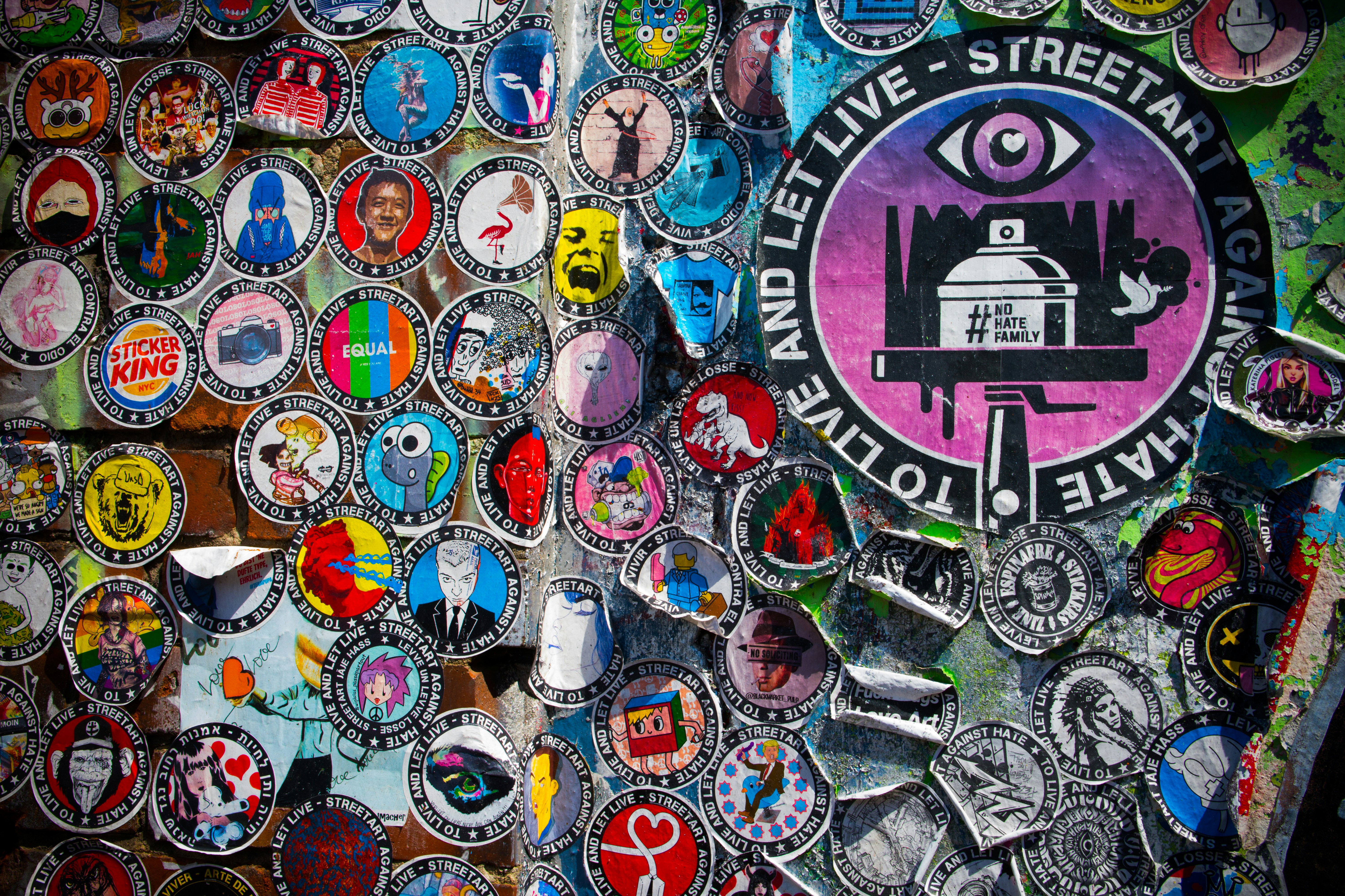 Sticker Mosaic: A Fractal of Buttons and Emblems