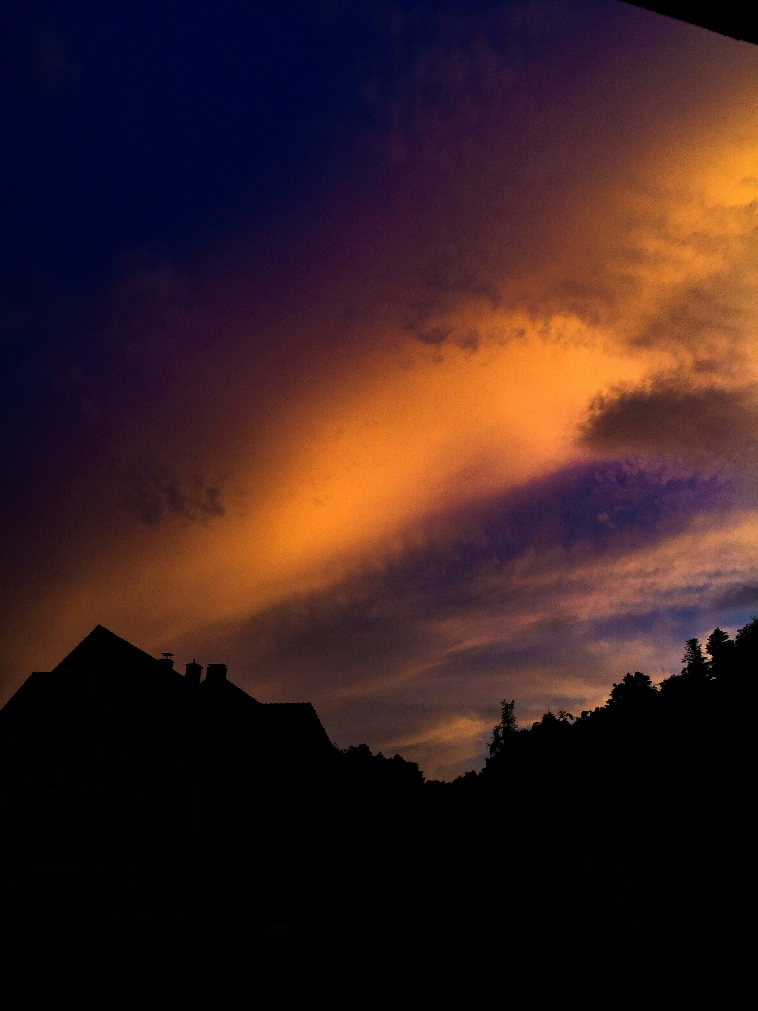 Ember Horizon Over a Suburban Silhouette at Dusk