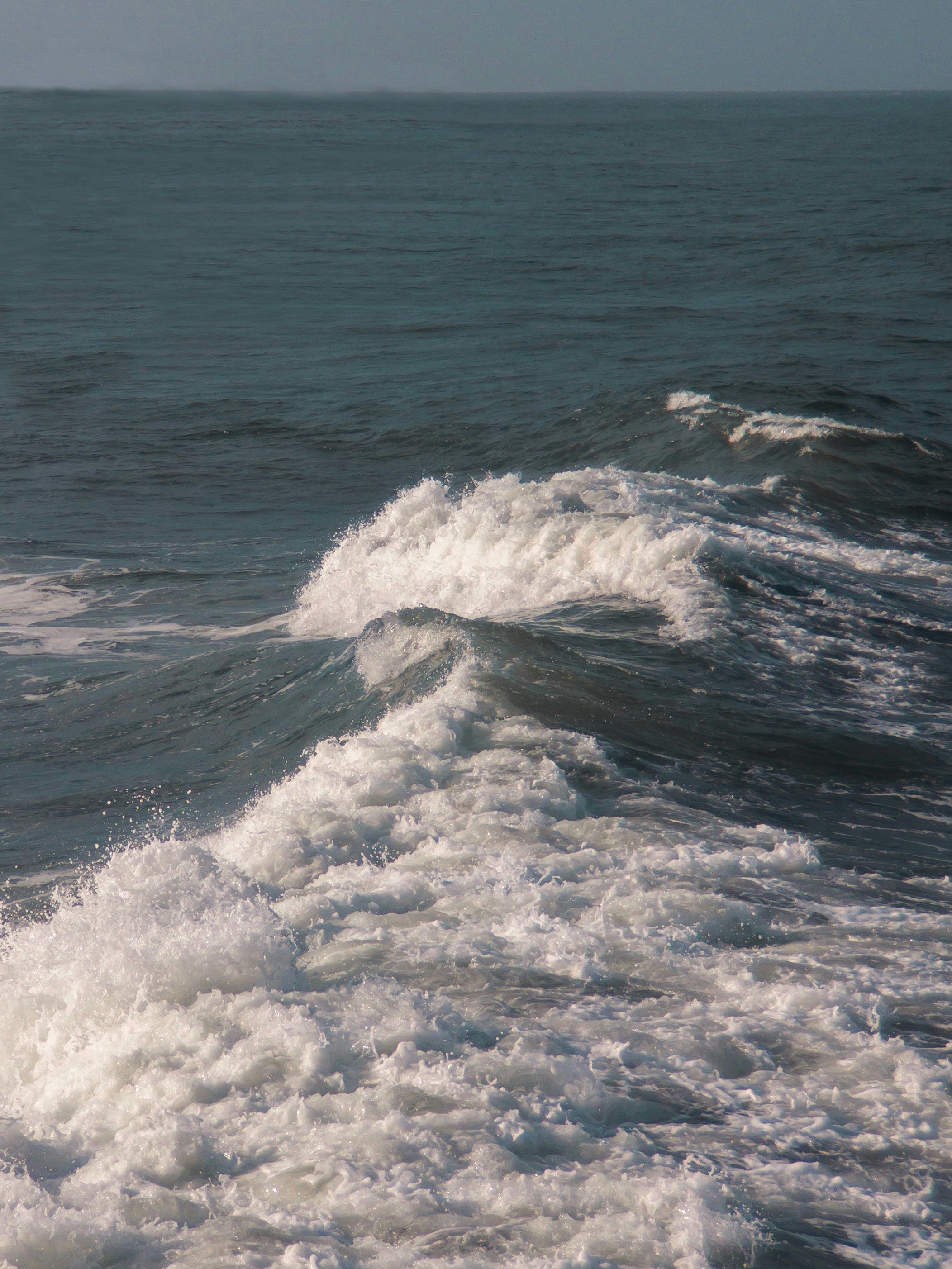 Crescent Crest over Churning Blue