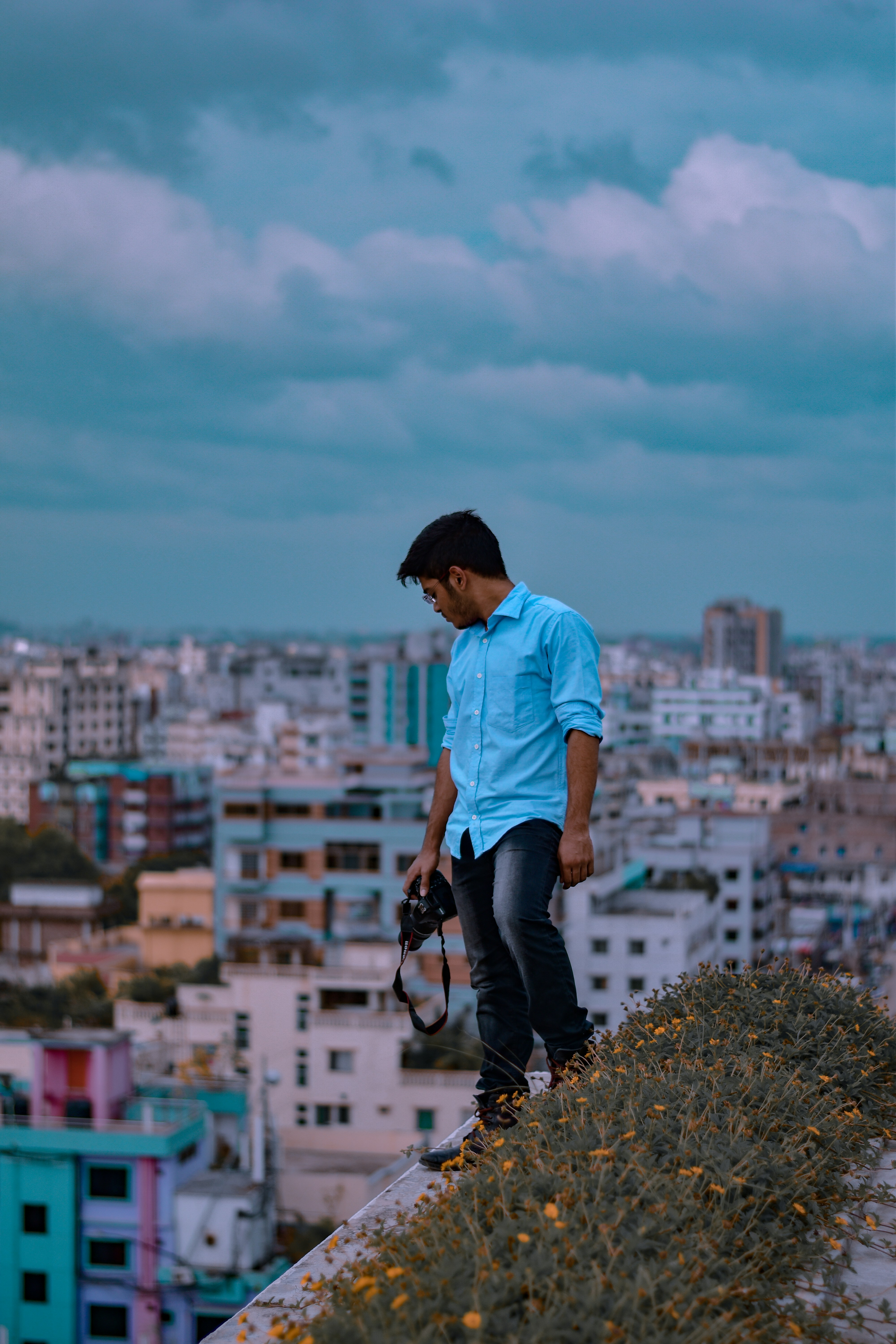 Rooftop Reverie: A Quiet Portrait Over a City of Colors