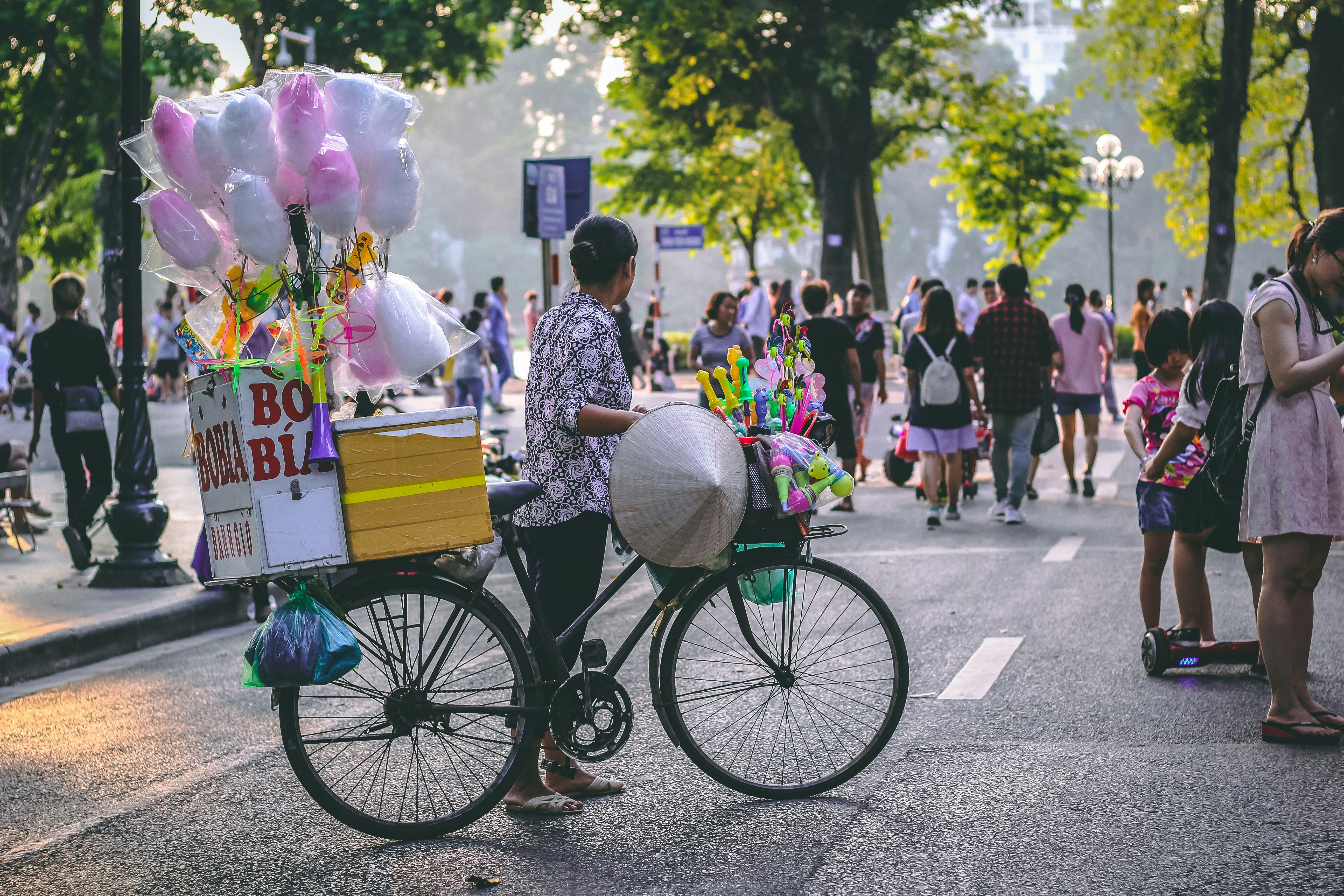 Person riding bicycle with cotton candies photo – Free Love Image on ...