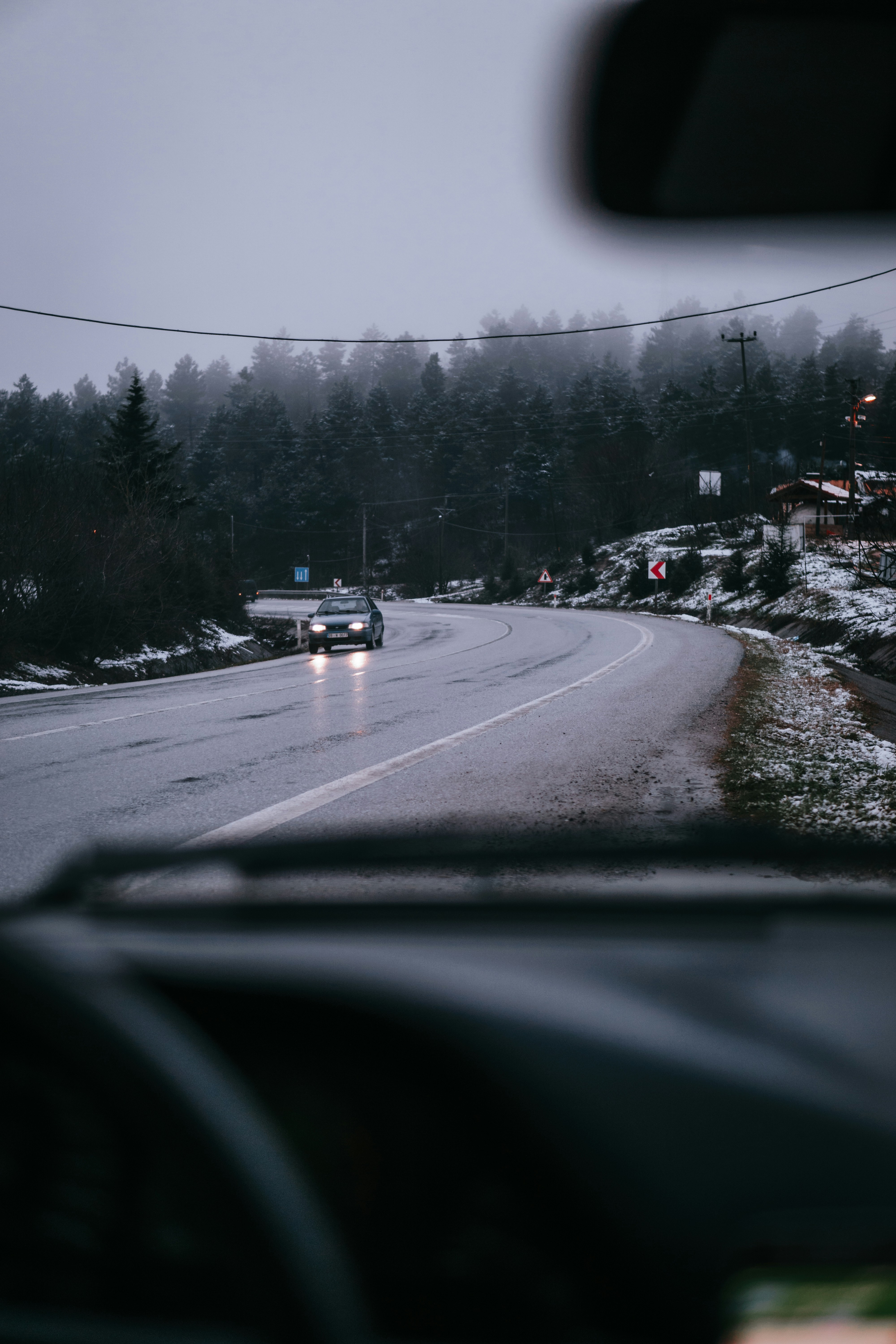 Headlights on a Snow-Washed Bend: A Quiet Mountain Drive