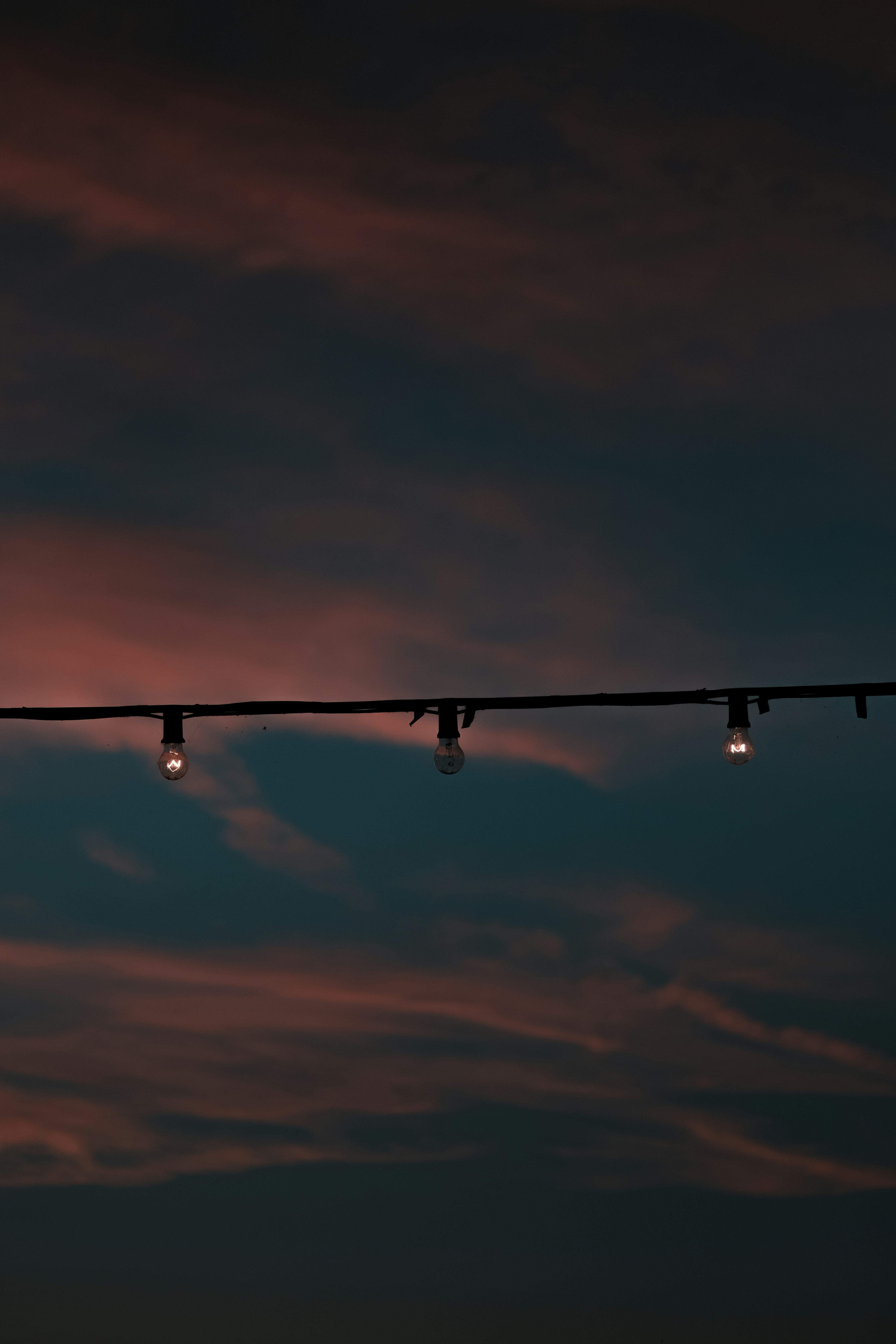 Twilight String Lights: a Row of Bulbs against a Velvet Sky