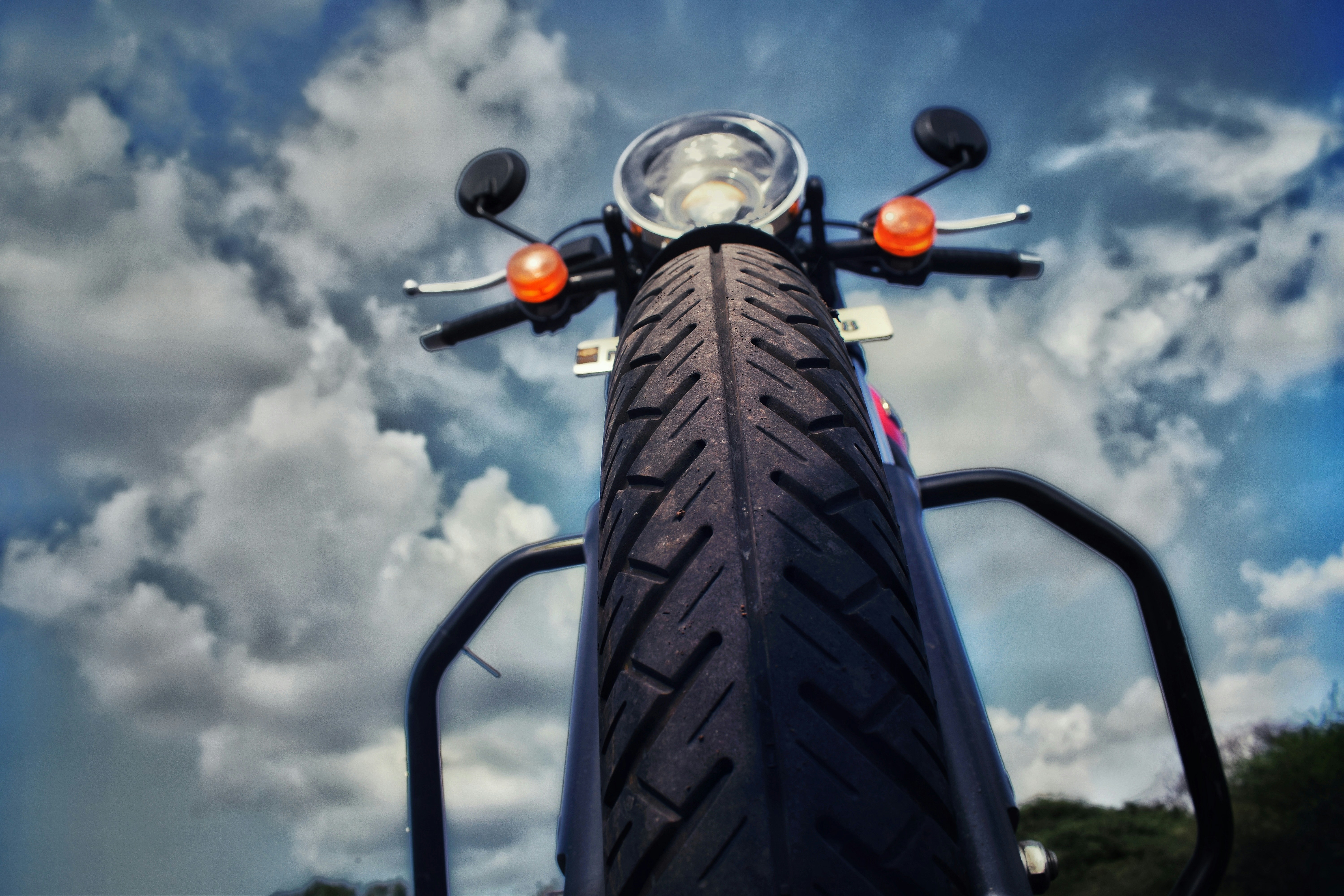 The Front Wheel's Upward Gaze: a Ground-Level Portrait of a Motorcycle