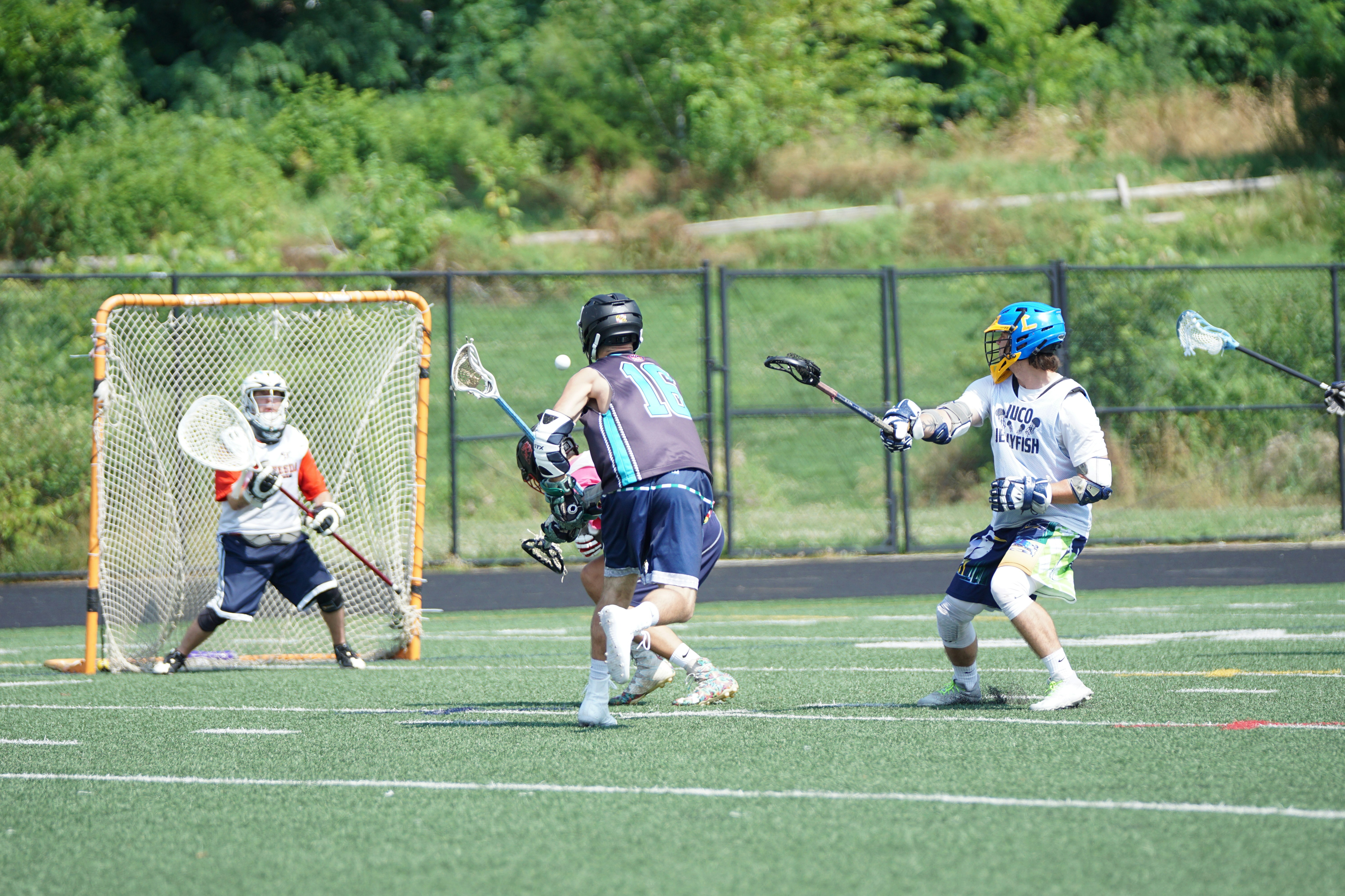 People playing lacrosse during daytime photo – Free Human Image on Unsplash