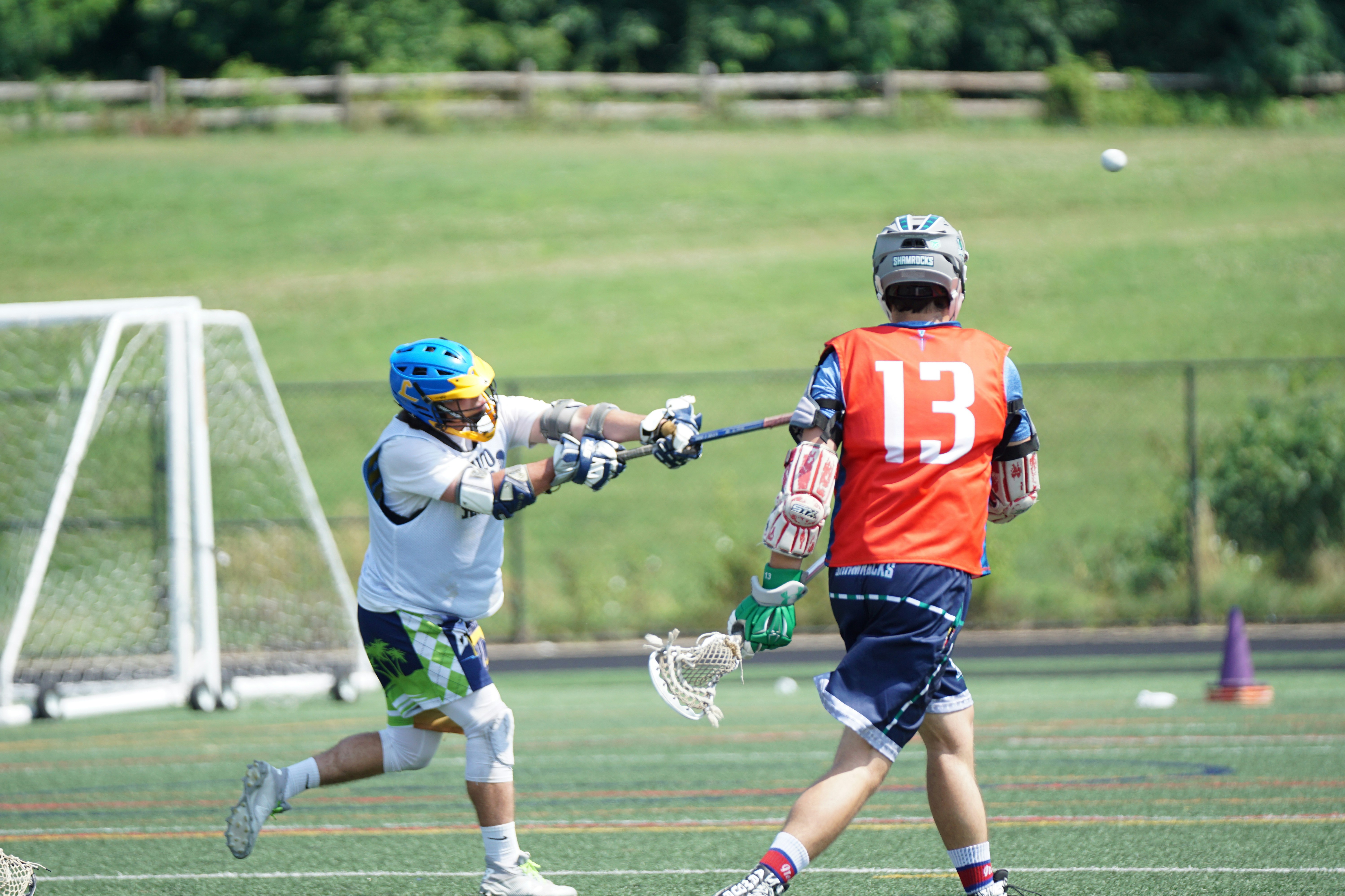 Two men playing lacrosse during daytime photo – Free Human Image on ...