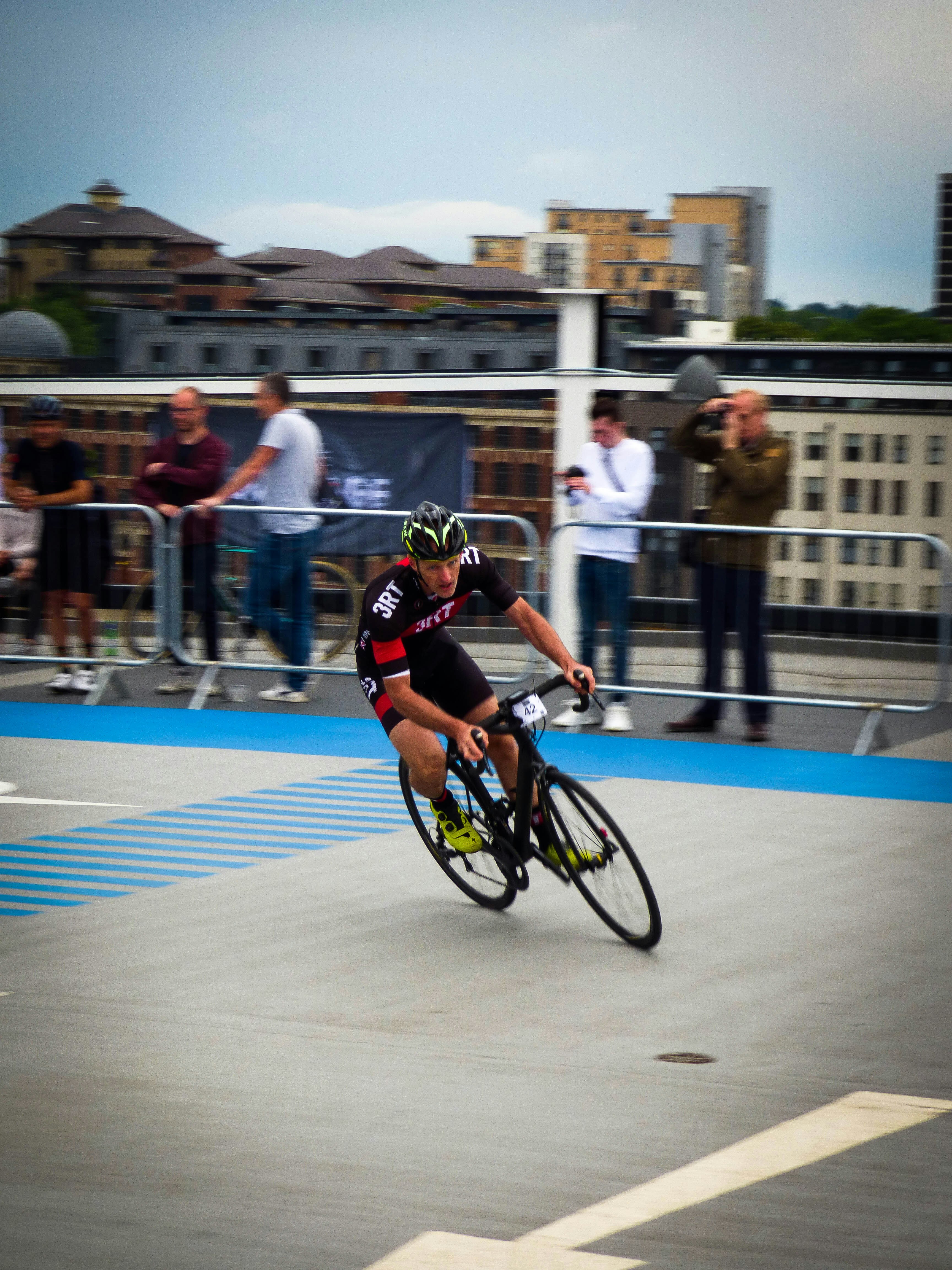 Rider in Control: A Sharply Drafted Curve on the City Rooftop