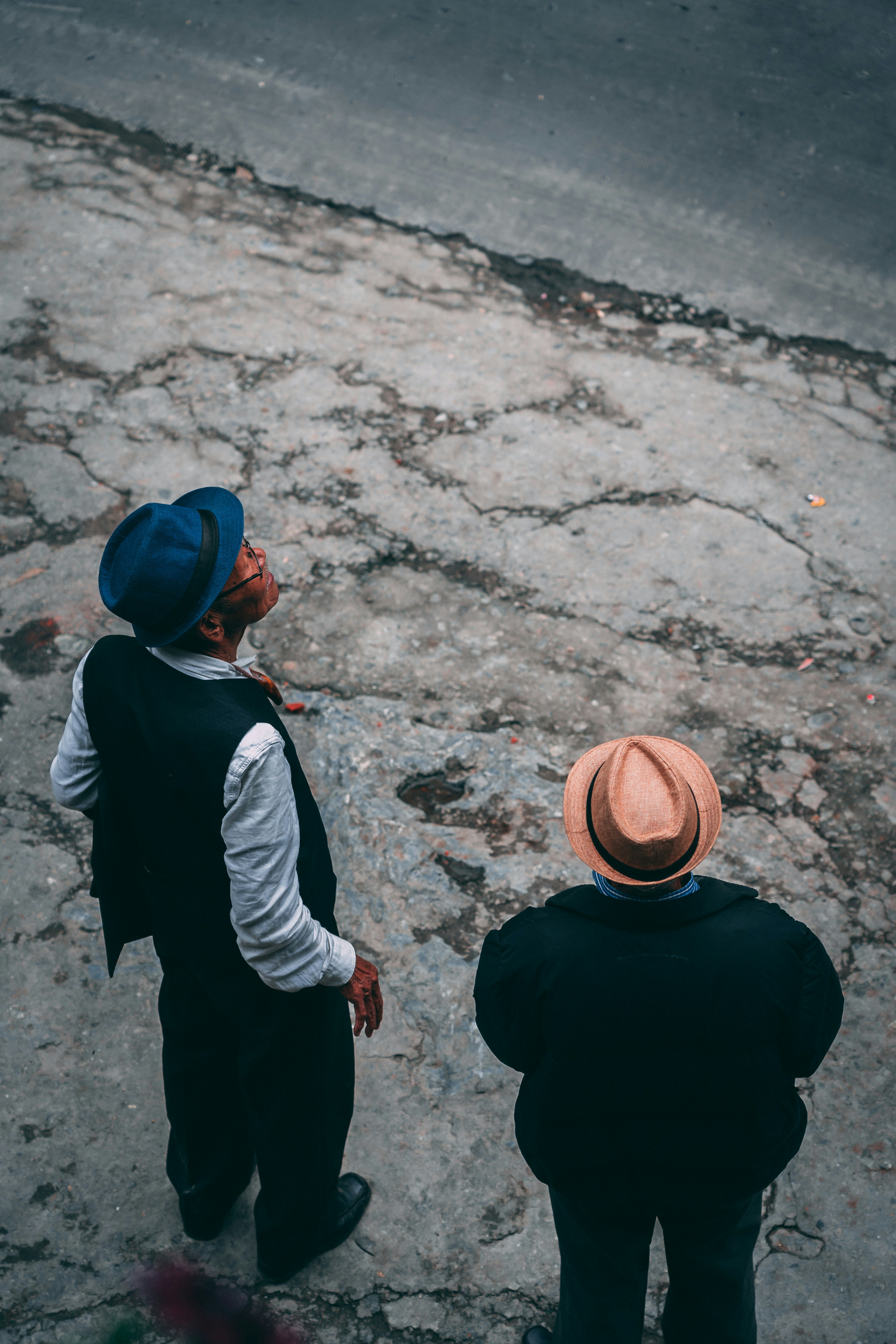 Two Vintage Hats, One Cracked Shore: An Elevated Encounter
