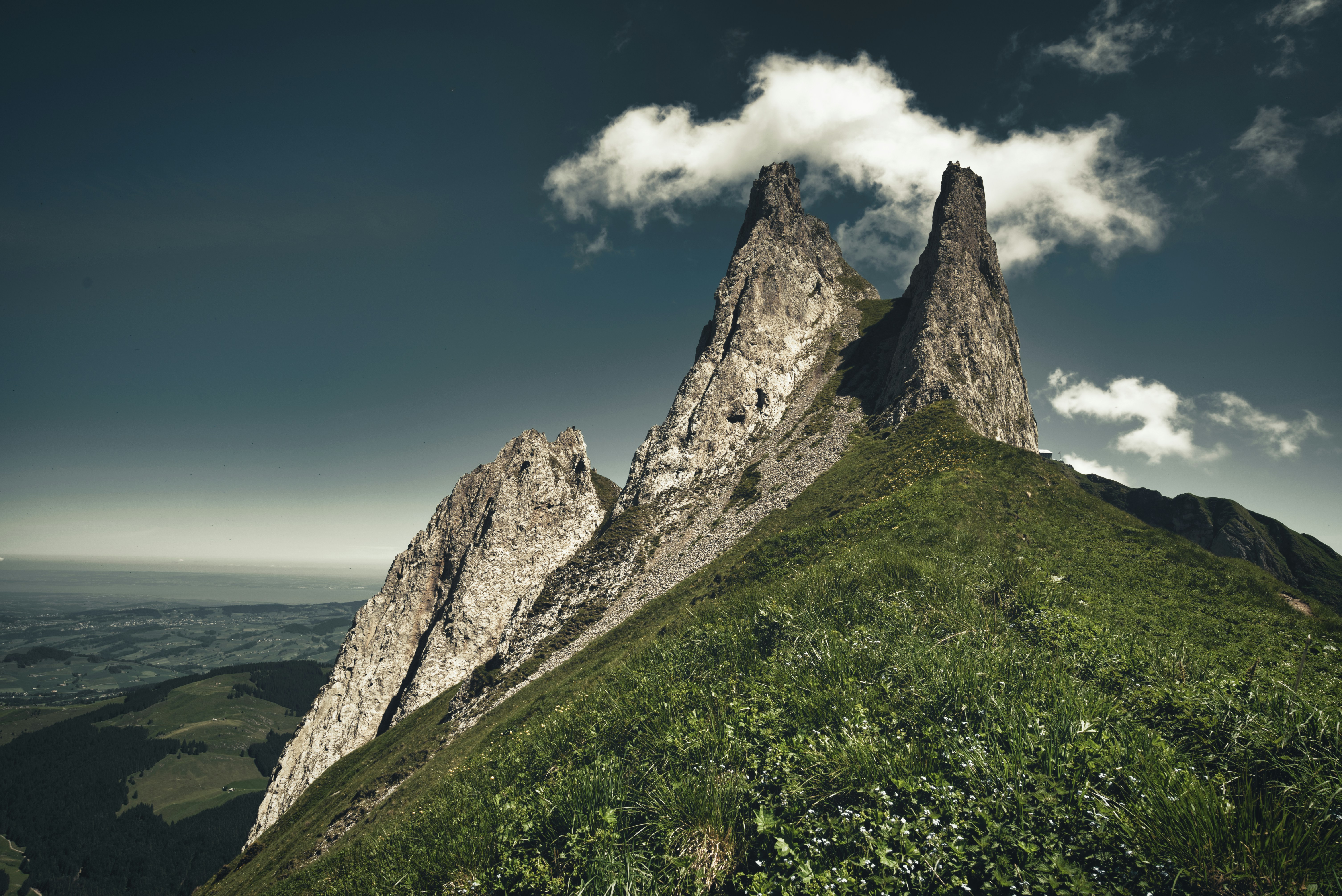 Twin Granite Spires Above the Verdant Ridge
