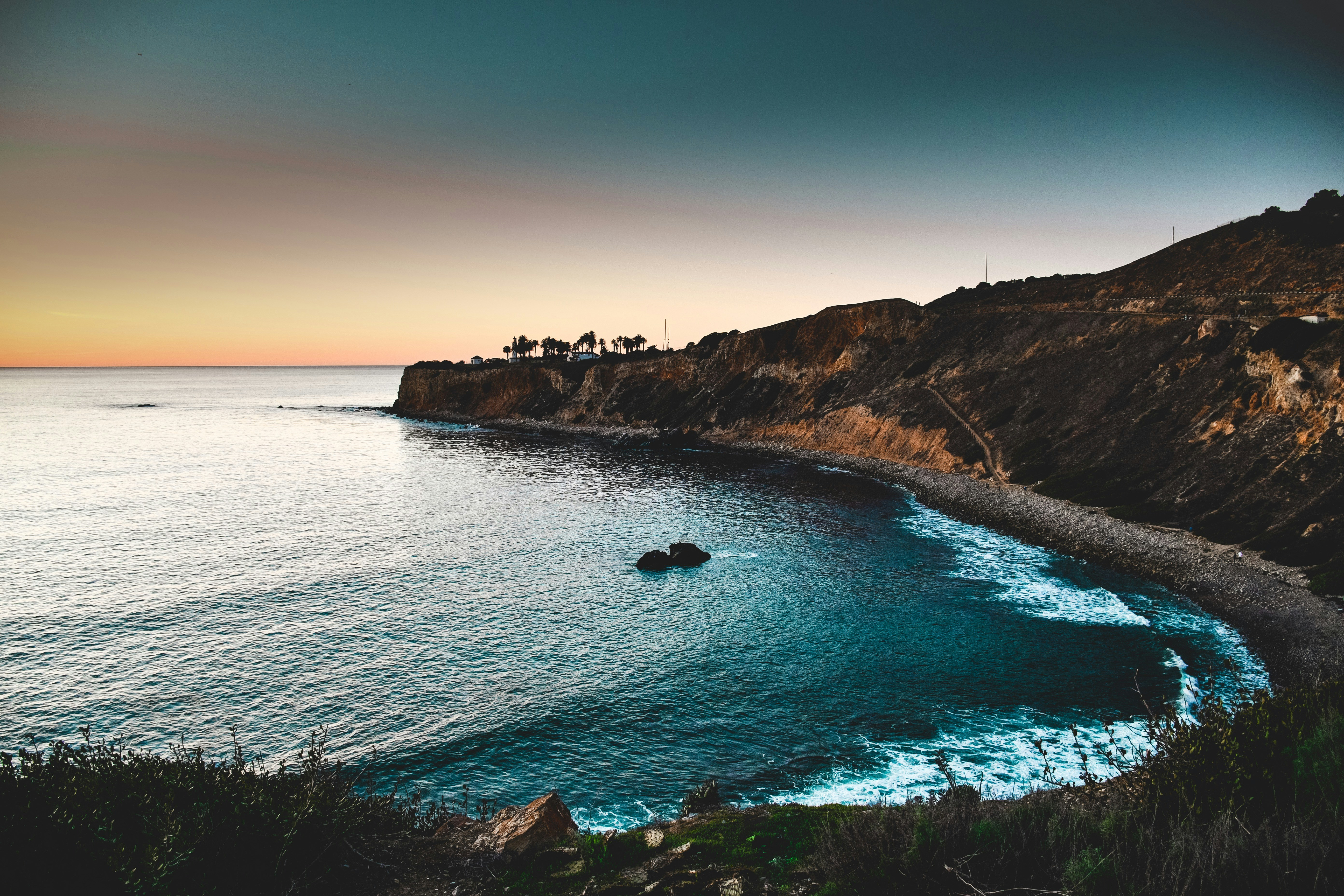Mountain facing ocean photo – Free Promontory Image on Unsplash