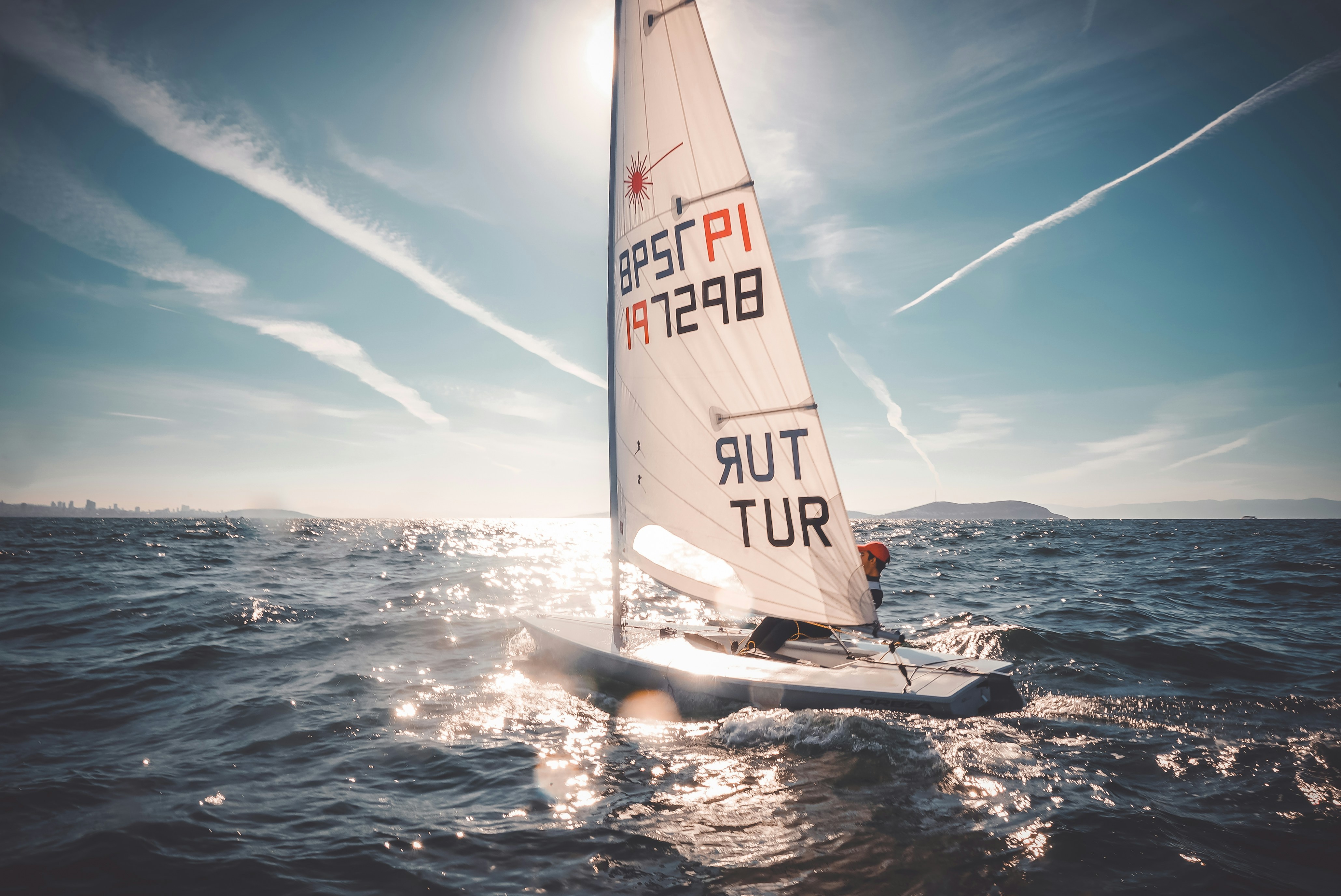 Sunlit Sails Over a Glistening Sea