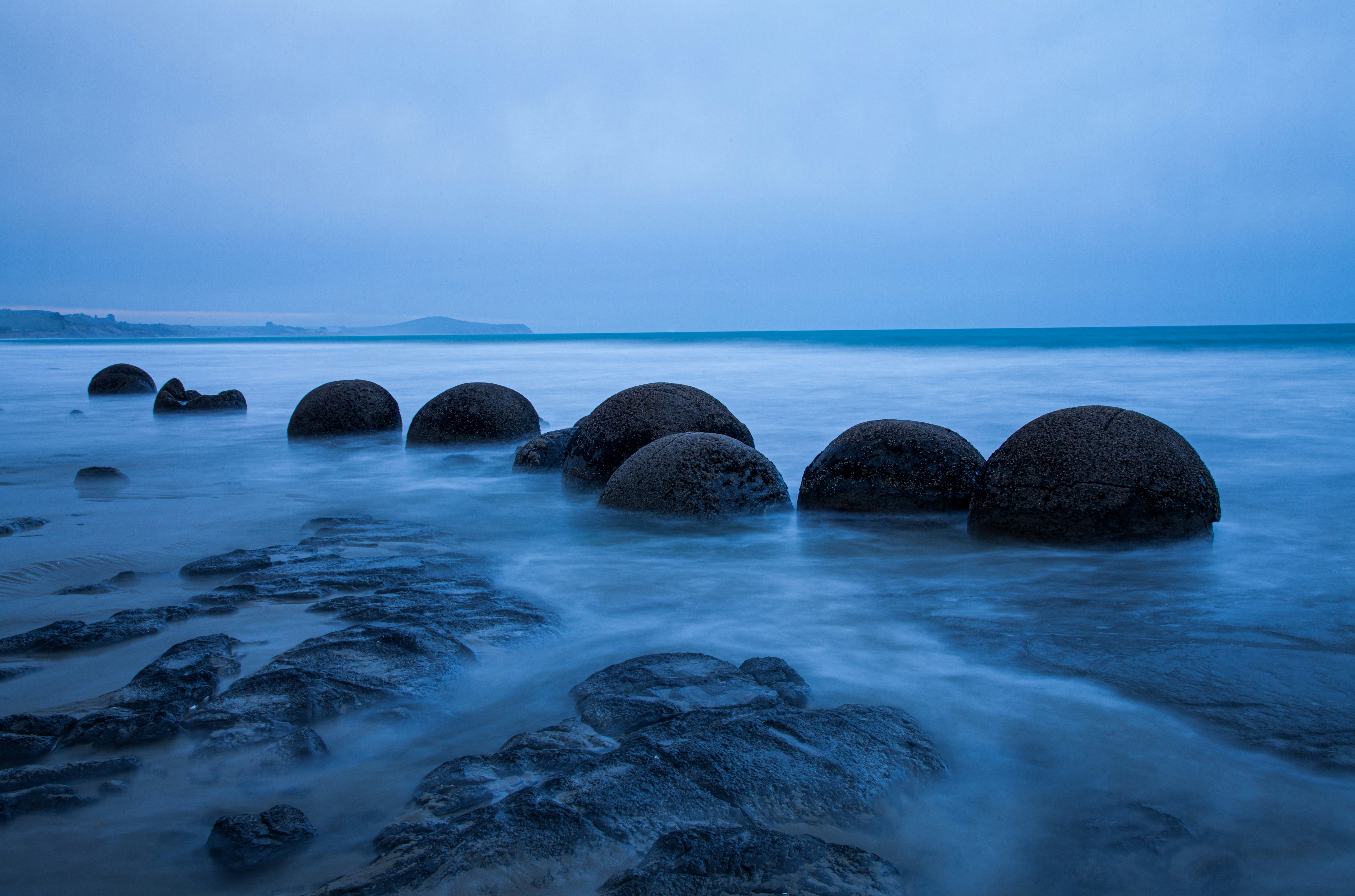 Selective photography of rocks surrounded by body of water photo – Free ...