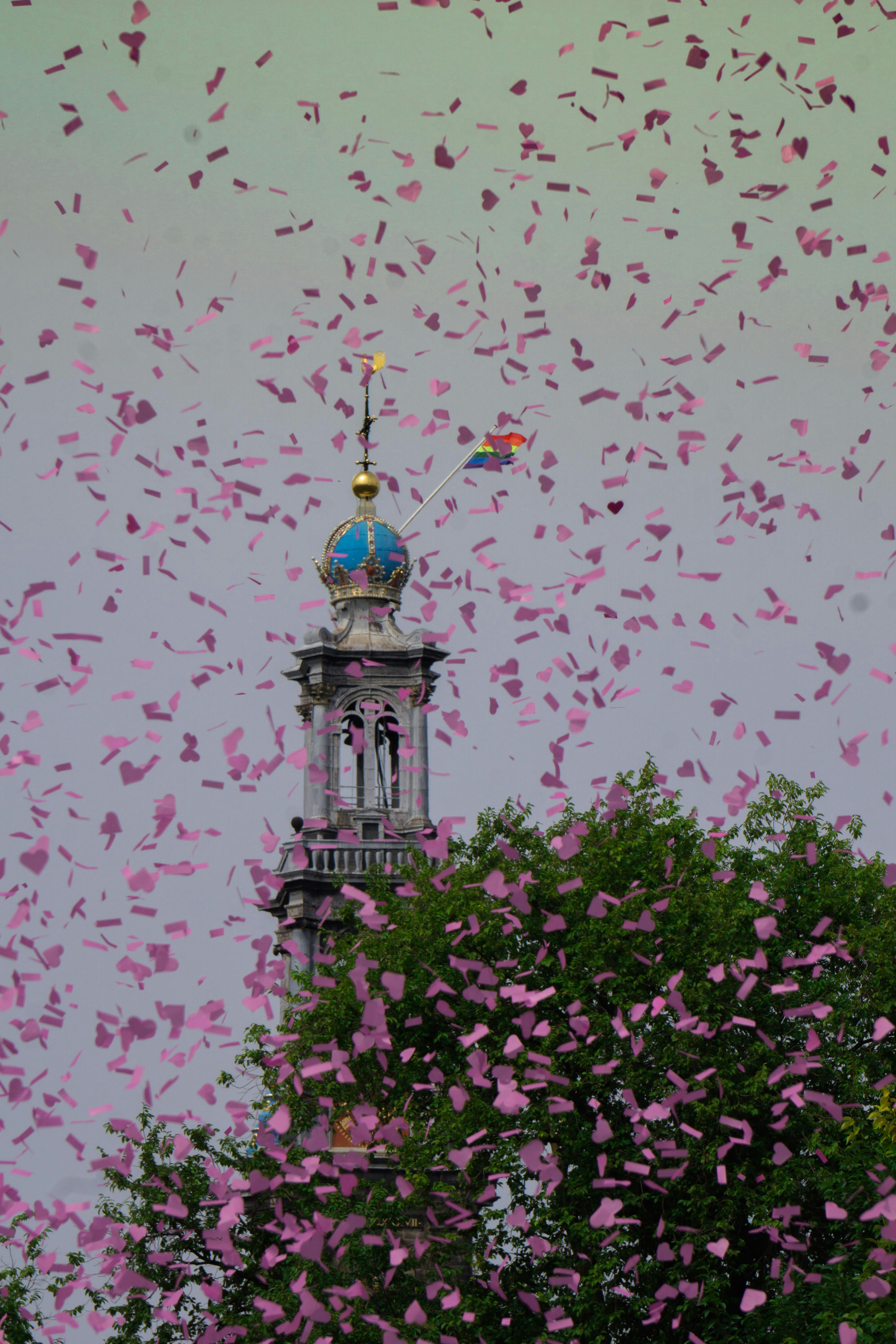 Tower Spire Beneath a Sky of Pink Confetti