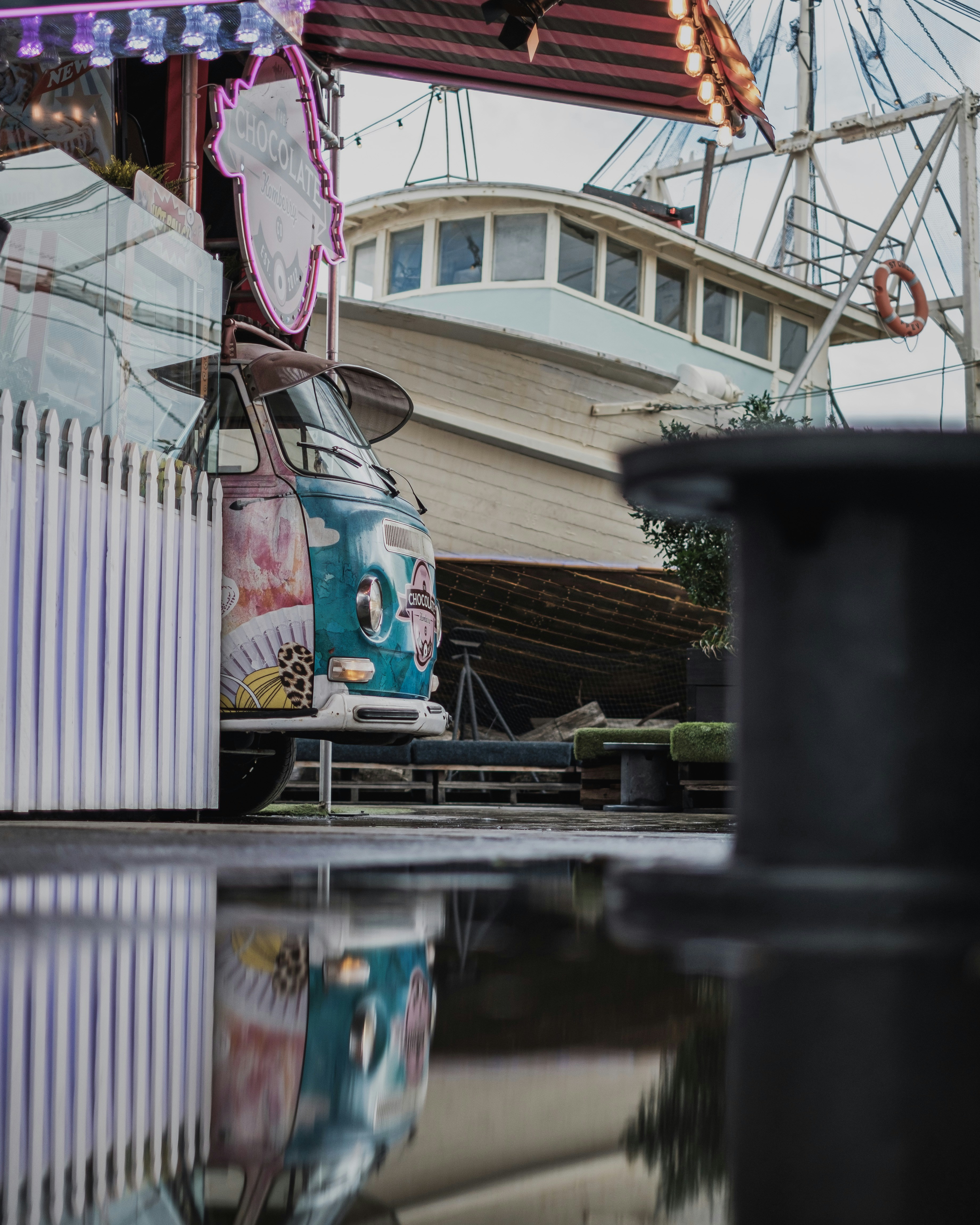 Reflection of a camper van on puddle of water photo – Free Grey Image ...