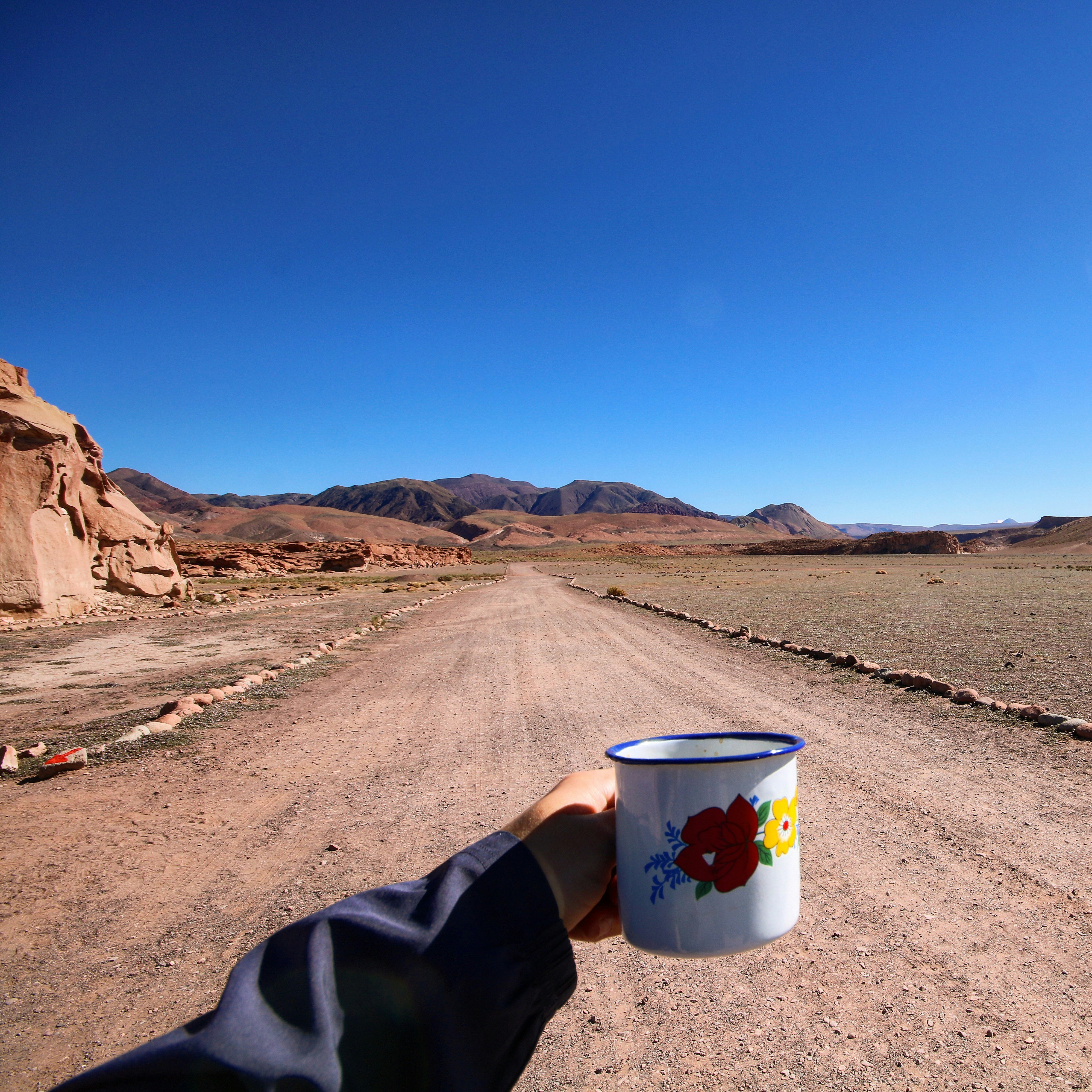 Desert Roadhand: A mug of quiet texture on an open horizon