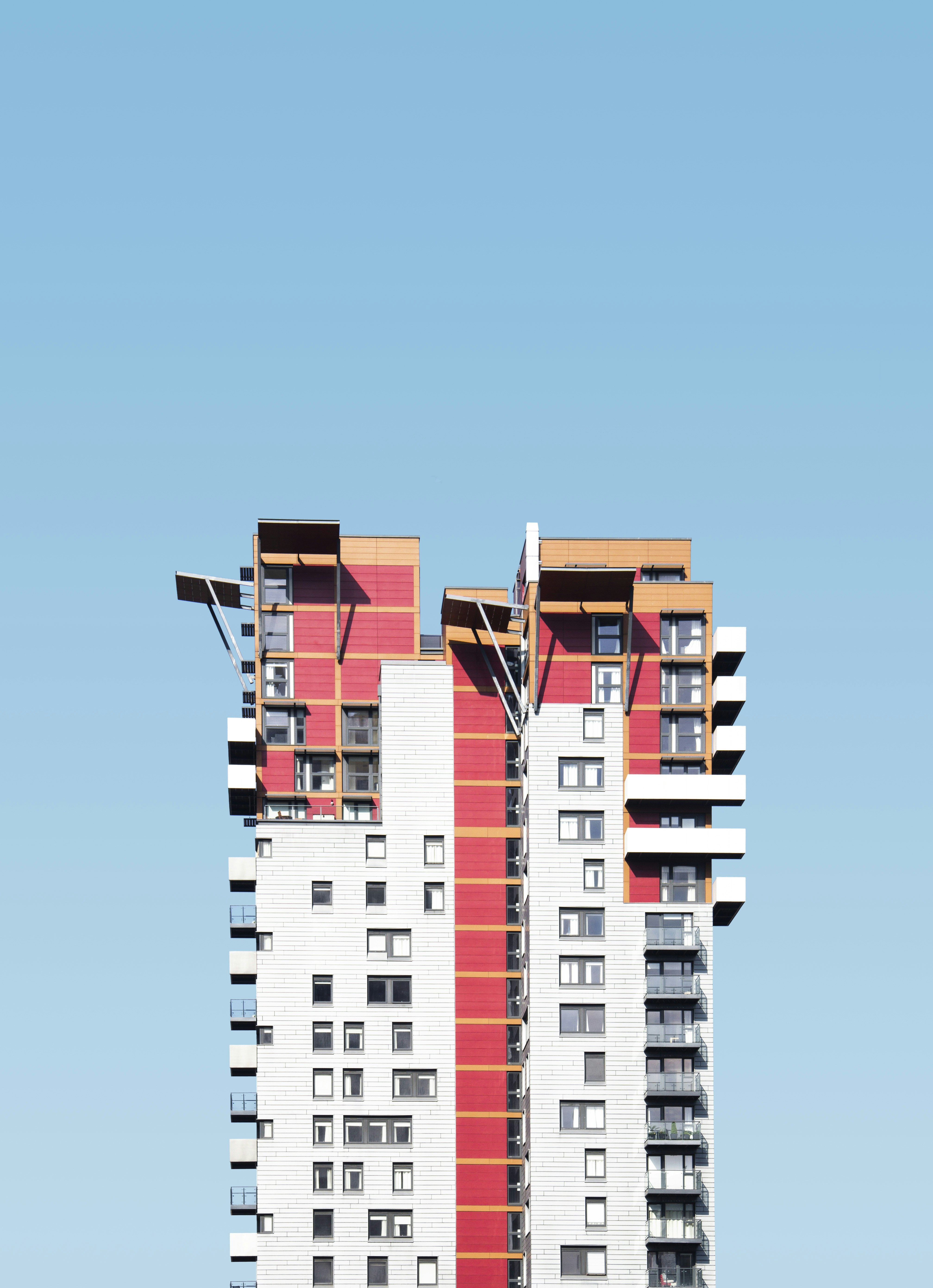 White and red high-rise building photo – Free Building Image on Unsplash
