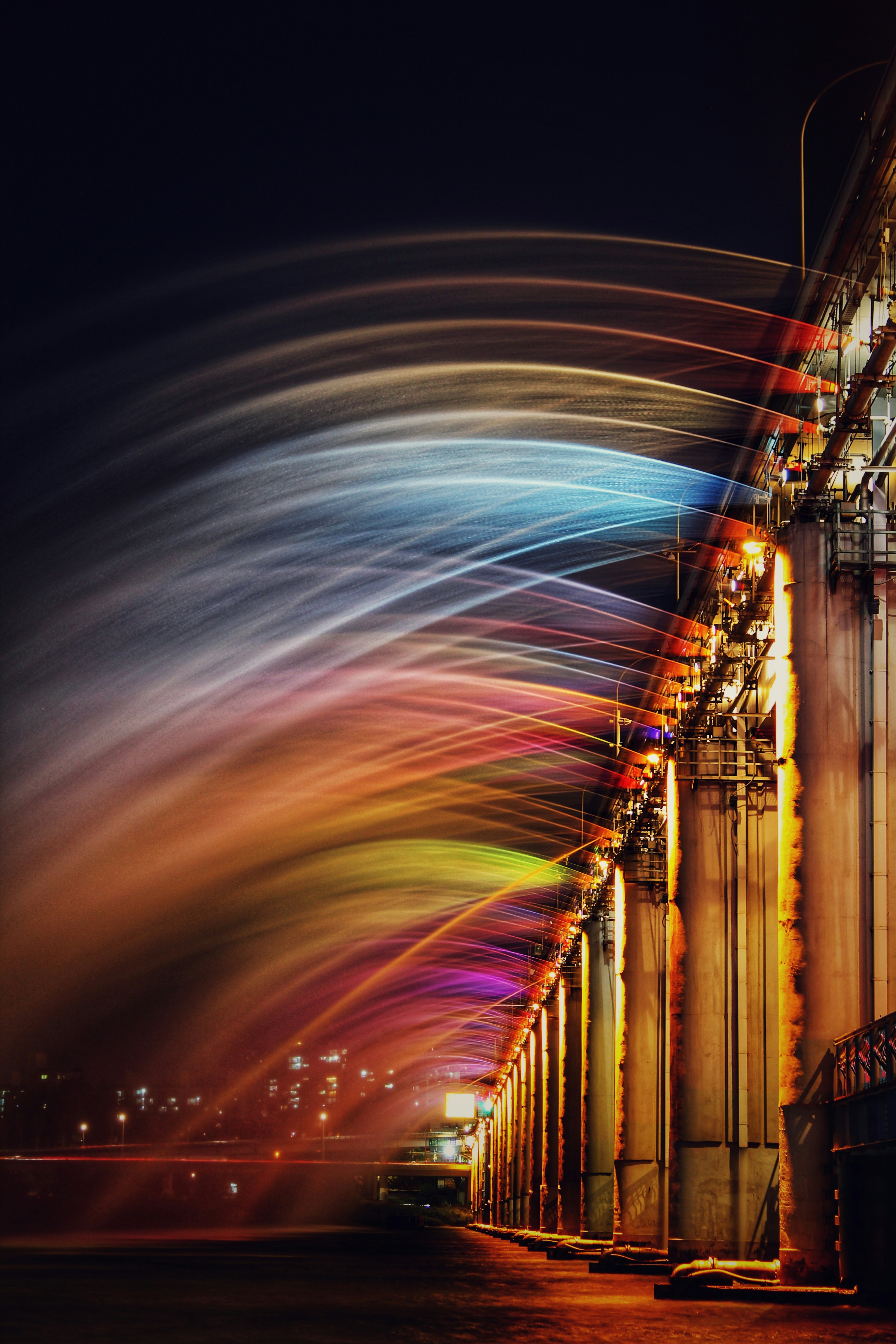 Rings of Light Over a Neon-Industrial Night