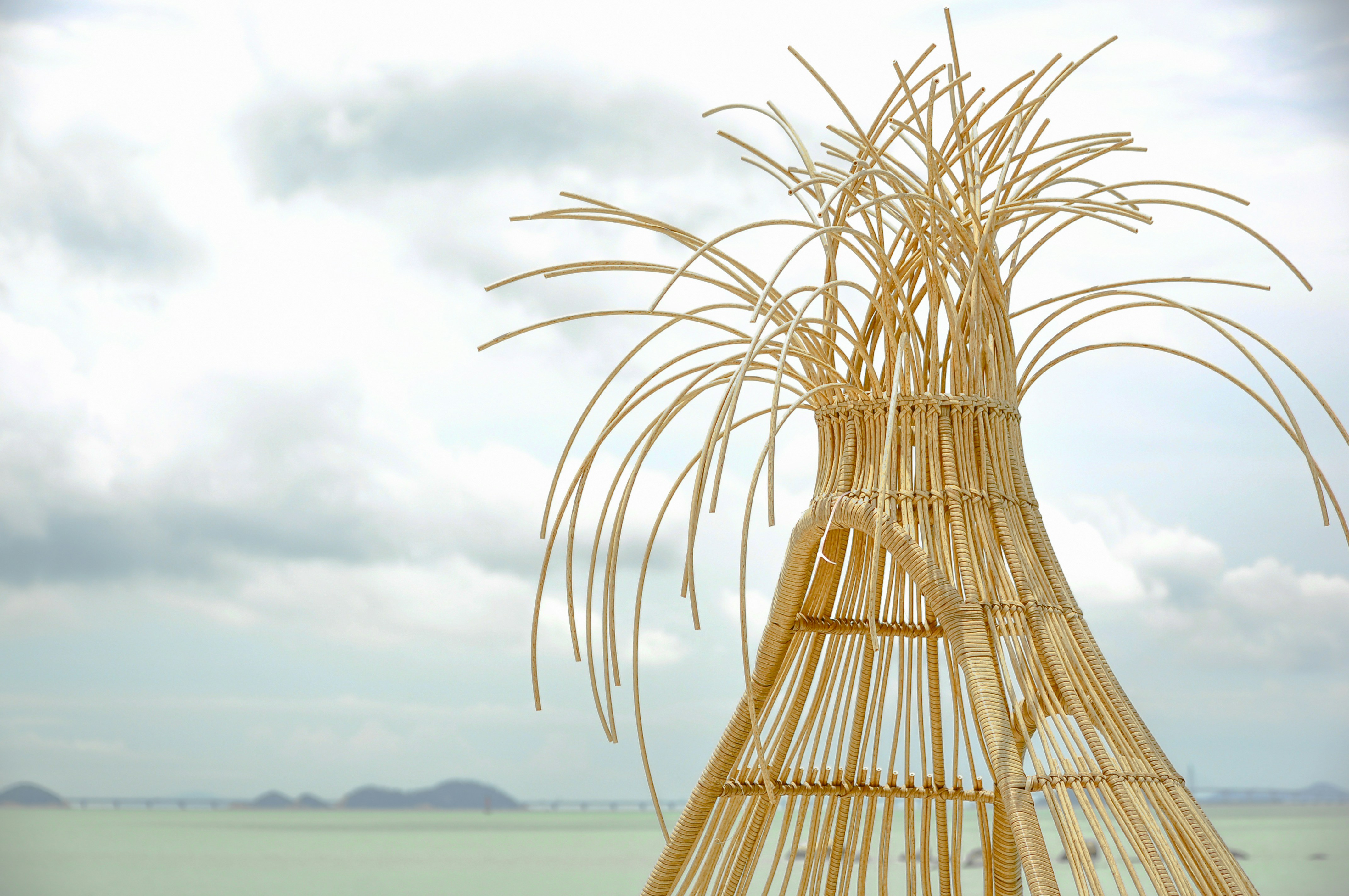 Wicker Lighthouse Silhouette Against a Sea Horizon