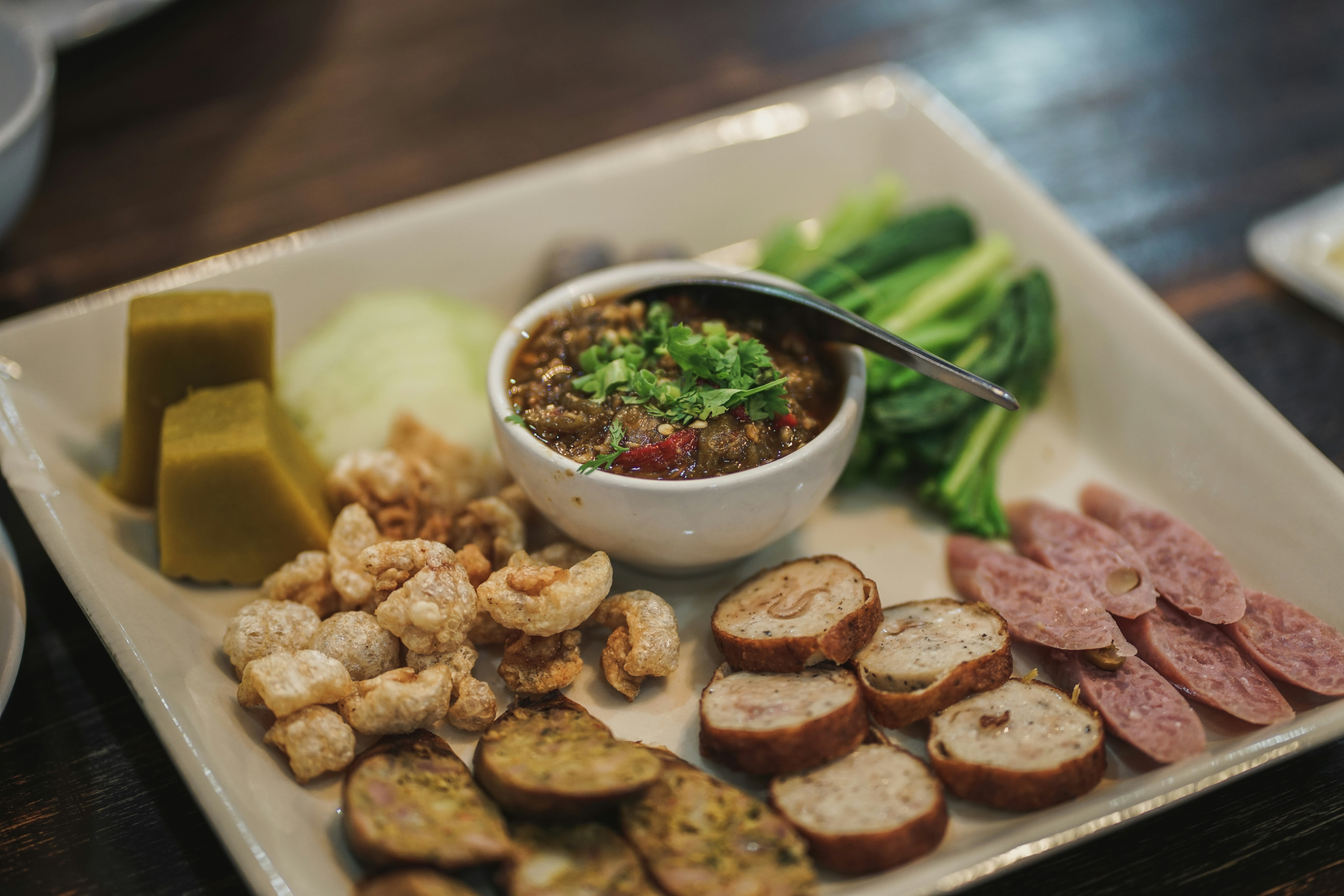 Charcuterie Mosaic: A Tray of Savory Bits with Herb Dip