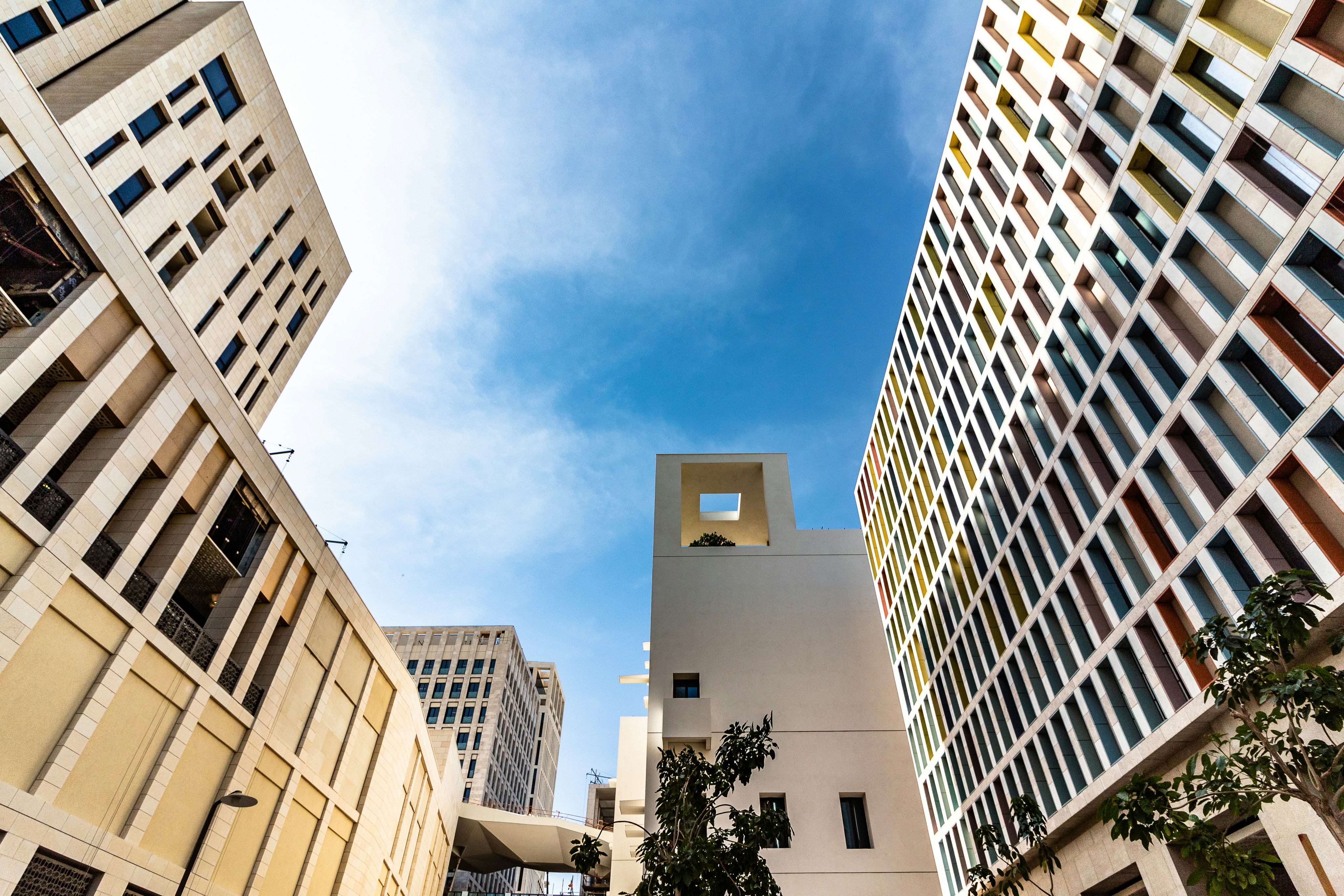 Architectural photo of beige buildings photo – Free Blue Image on Unsplash