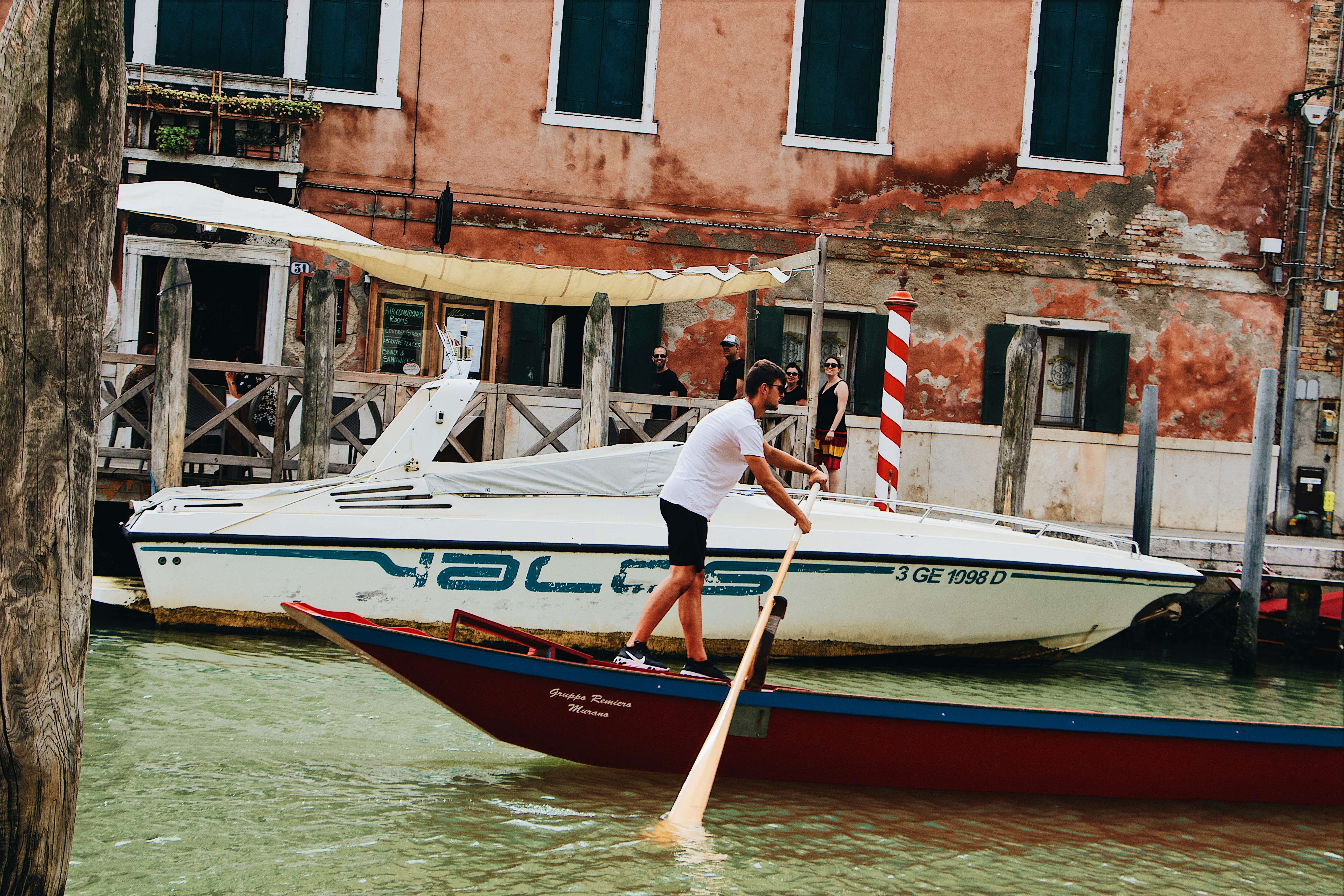 Paddle Rhythm: A Gondola Standstill Amid Venetian Facades