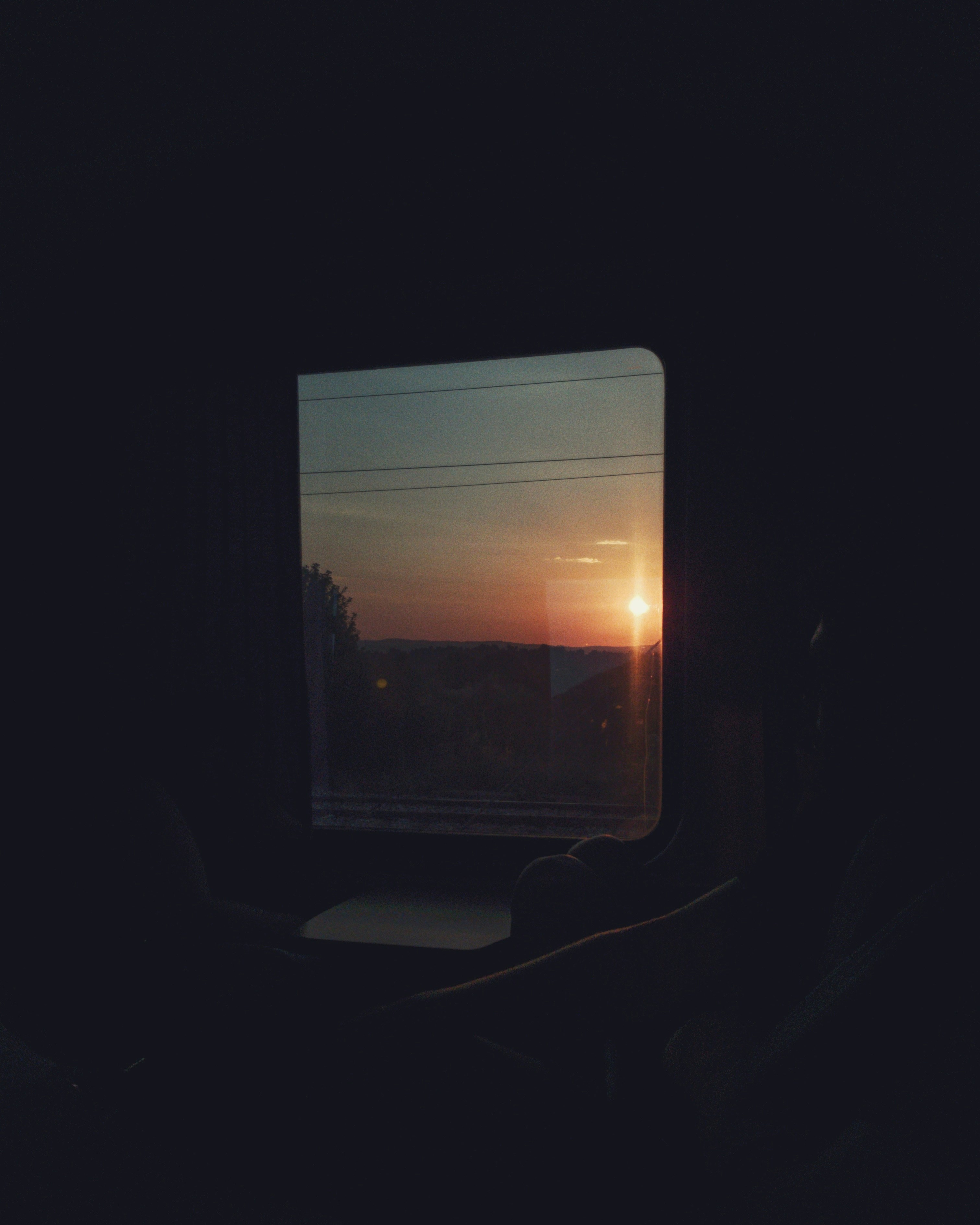 A view of a sunset through a window photo – Free Travel Image on Unsplash