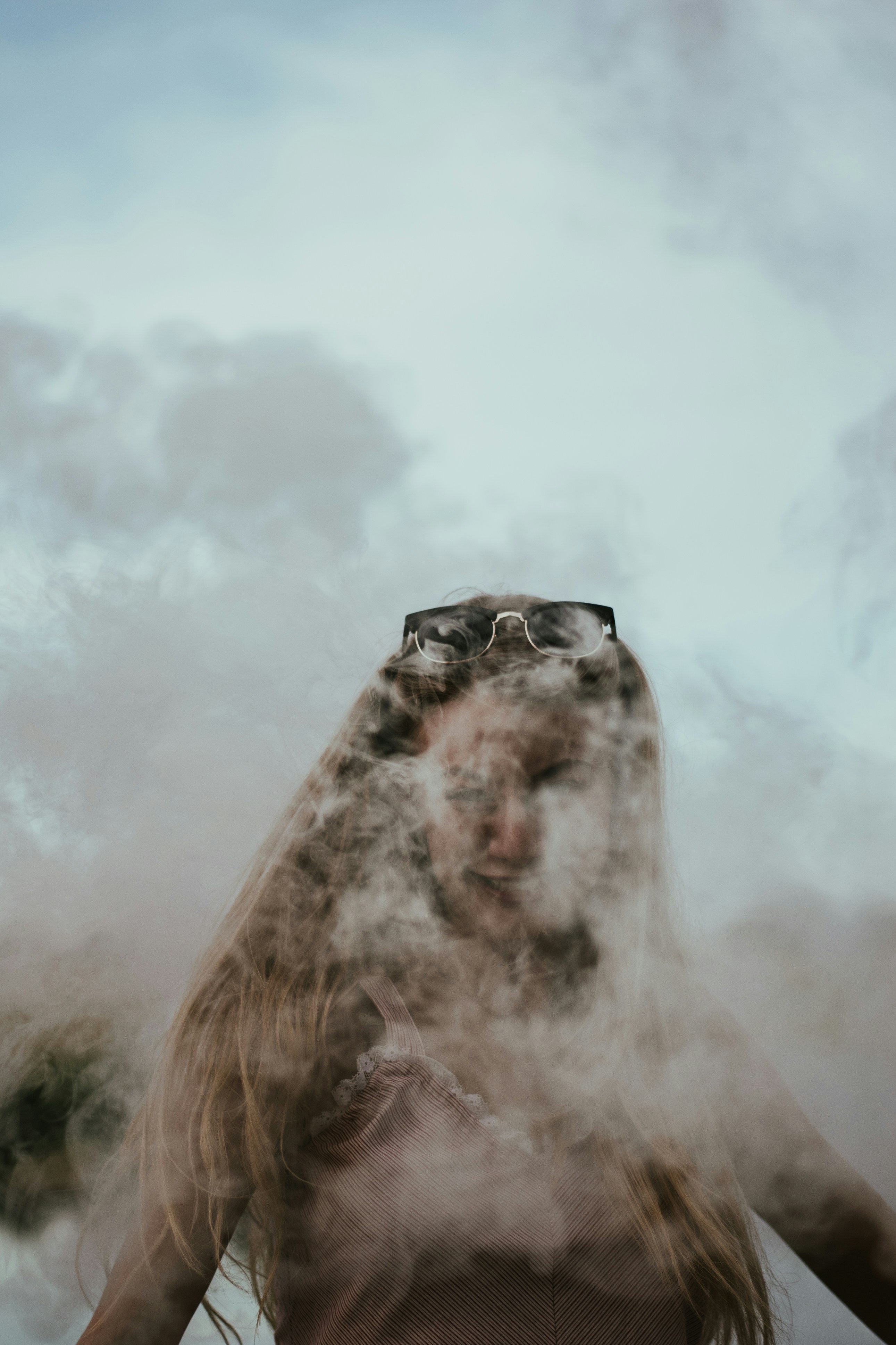 Veiled Portrait: A Face Emerges Through Steam and Mystique