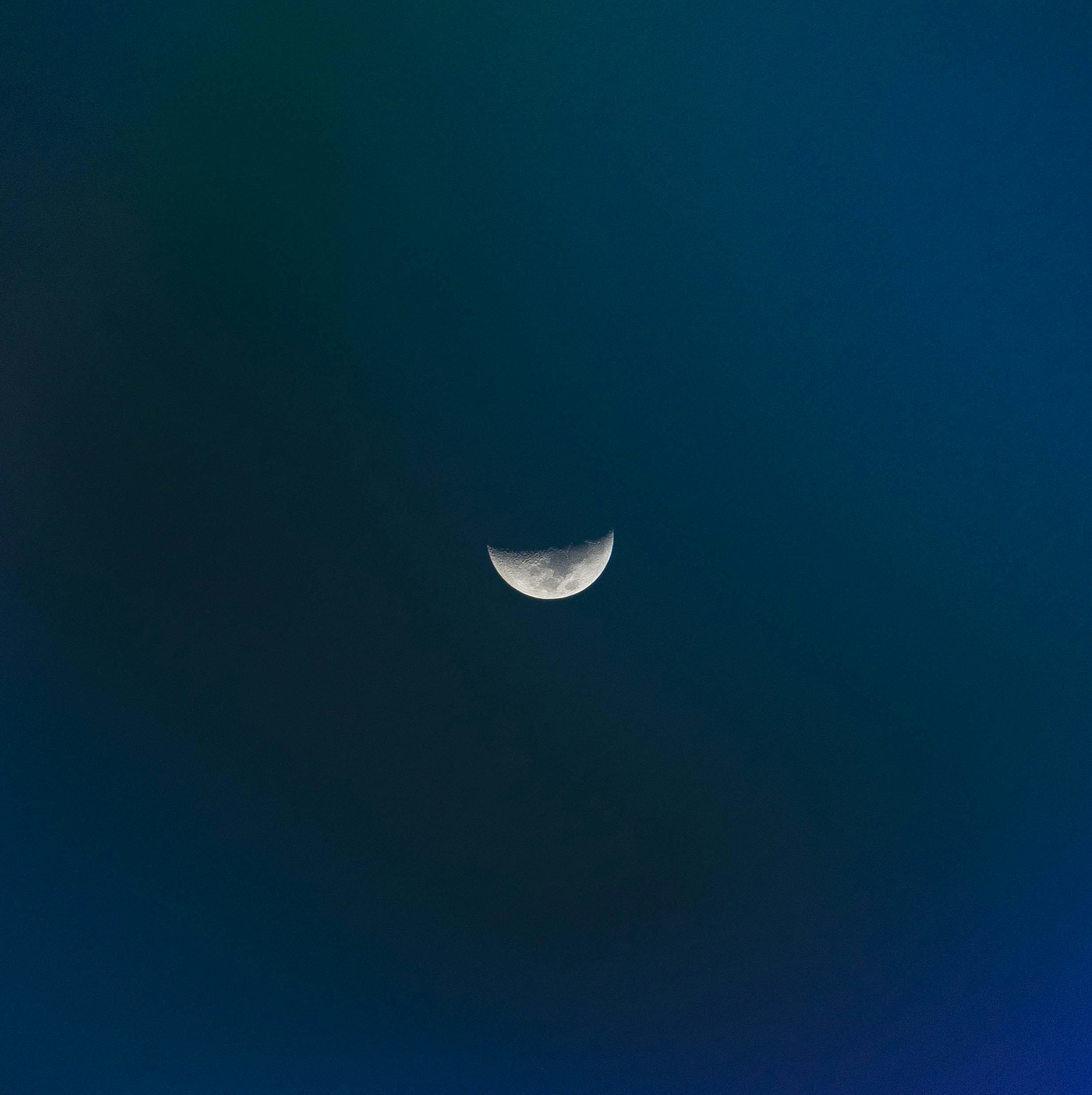 Celestial Whisper: The Moon's Subtle Glow