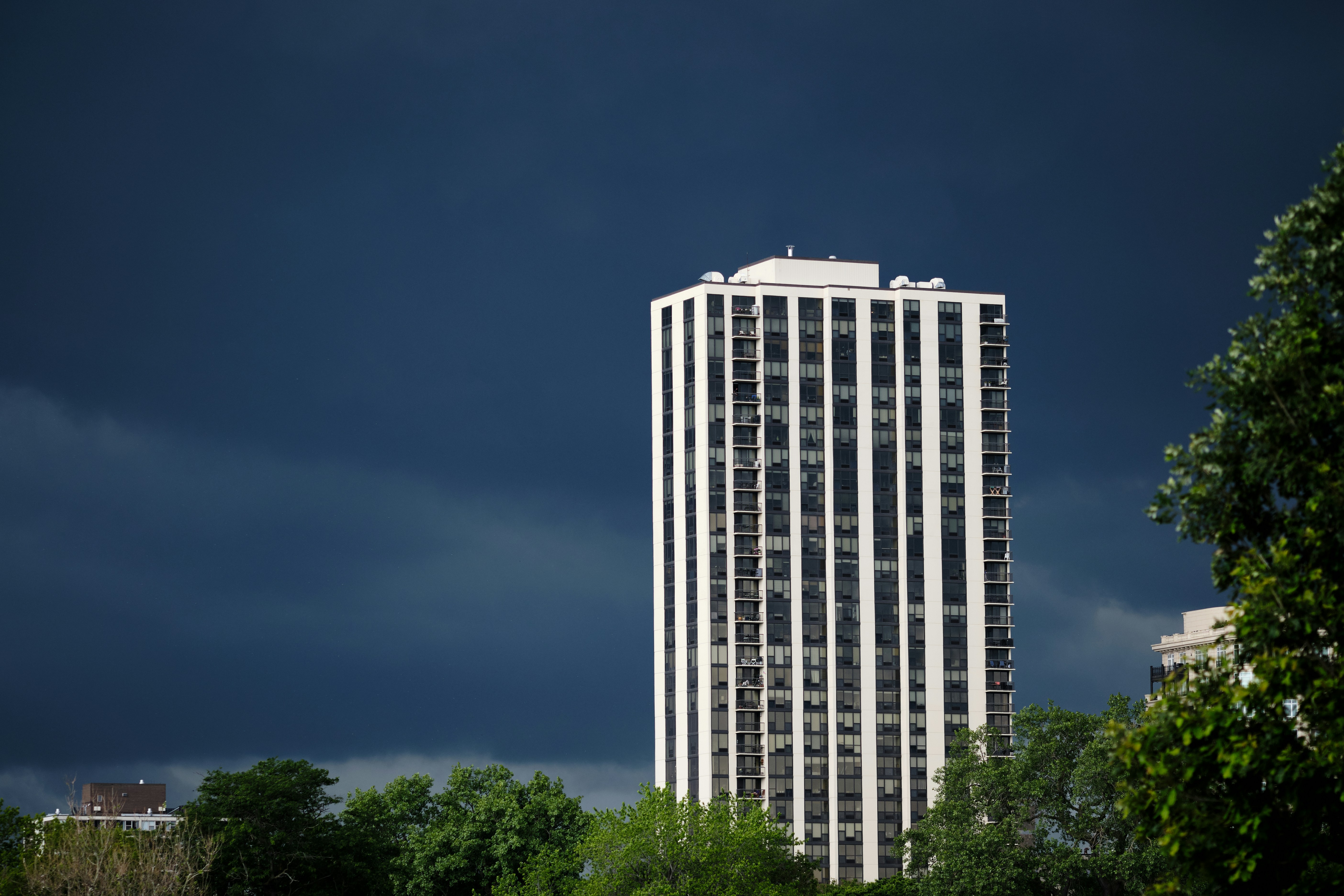 white and black building under blue sky at daytime