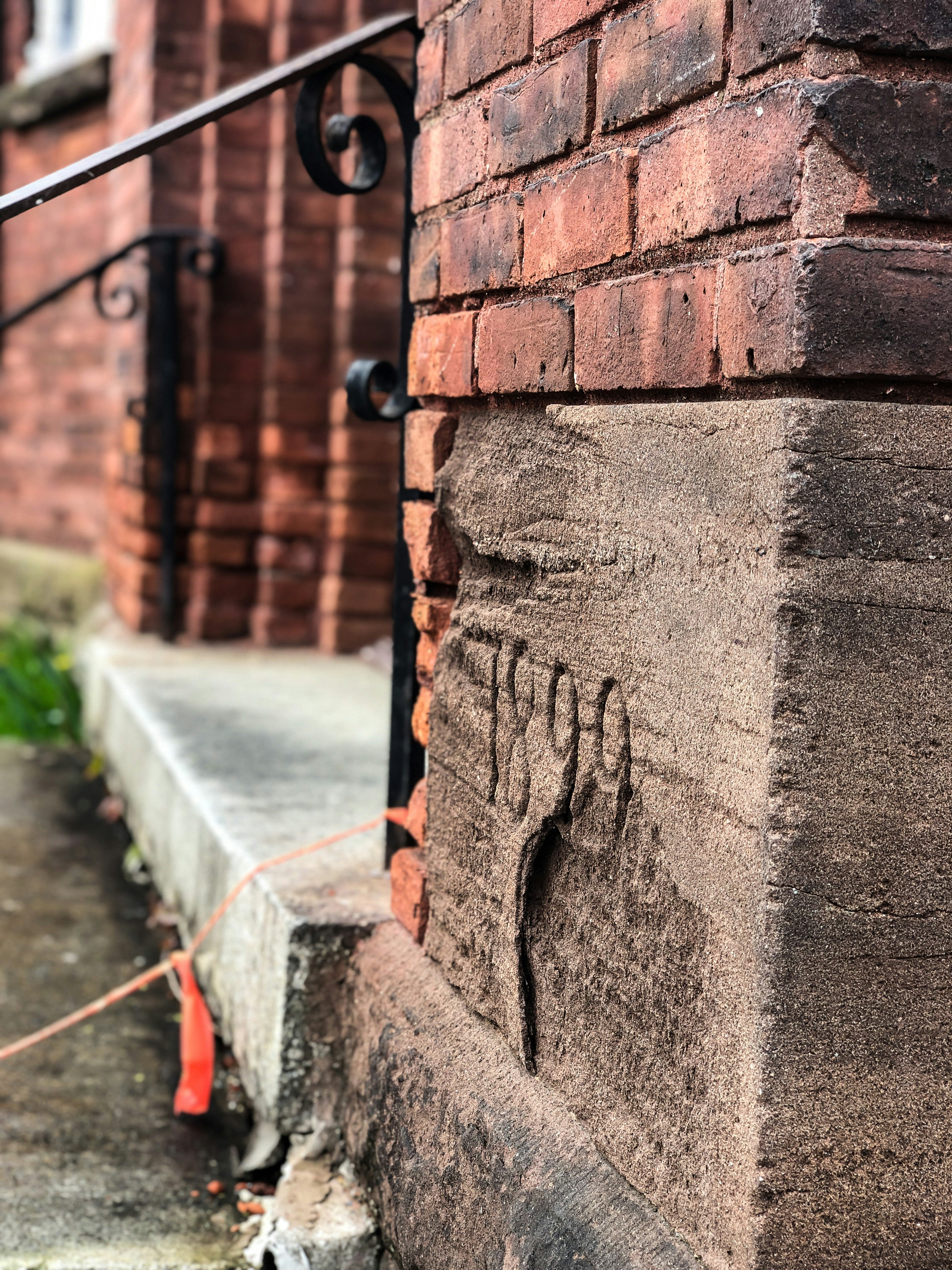 Cornerstone of Weathered Texture: Brick, Concrete, and Iron